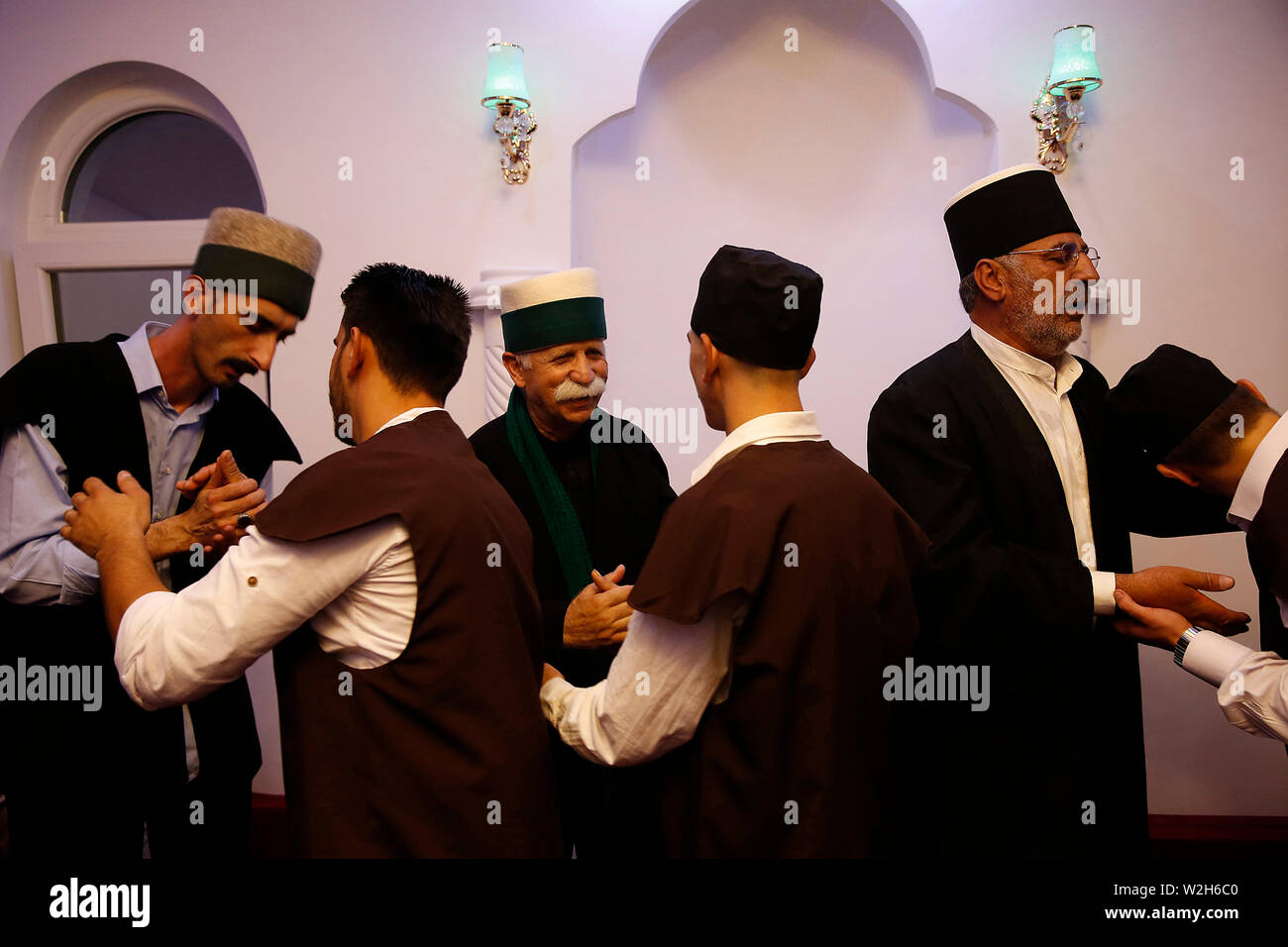 Halvetiye sufi tariqa zikhr in Gjakova, Kosovo. Hugging and hand ...