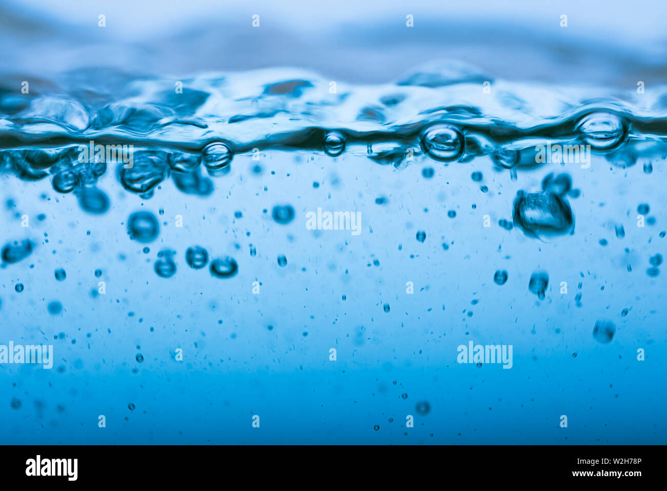 Water splash, clear blue water with waves and bubbless Stock Photo - Alamy