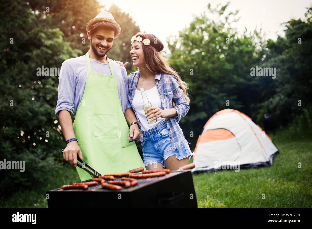 Group of happy friends having outdoor barbecue laughing together Stock ...
