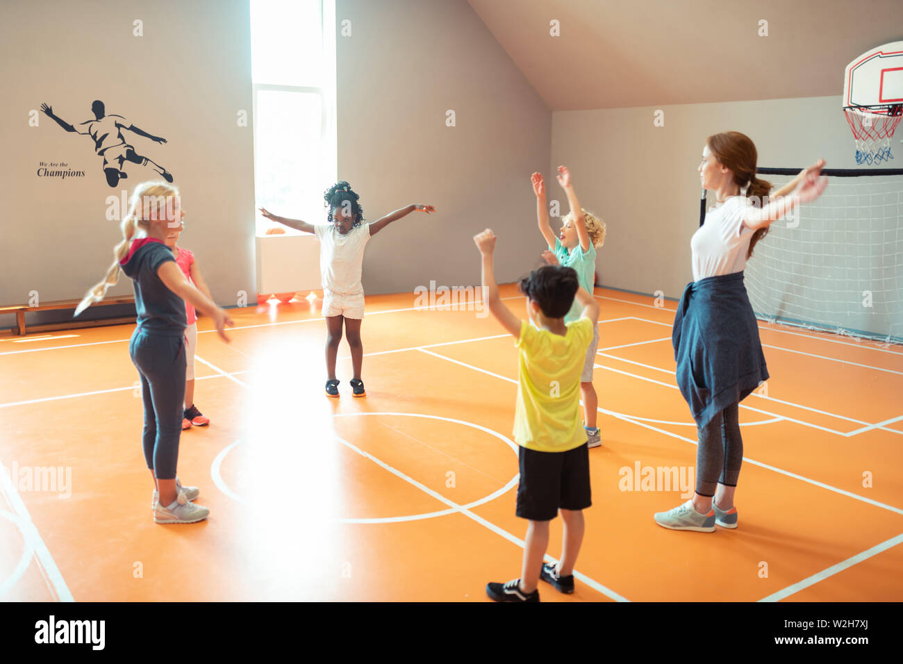 School children exercising during their sports lesson Stock Photo - Alamy