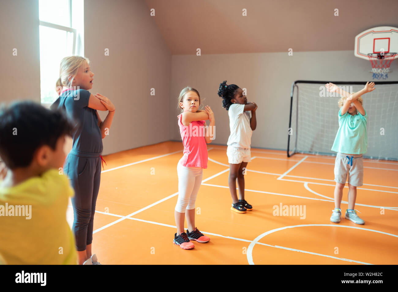 Pupils training together at the sports lesson Stock Photo - Alamy