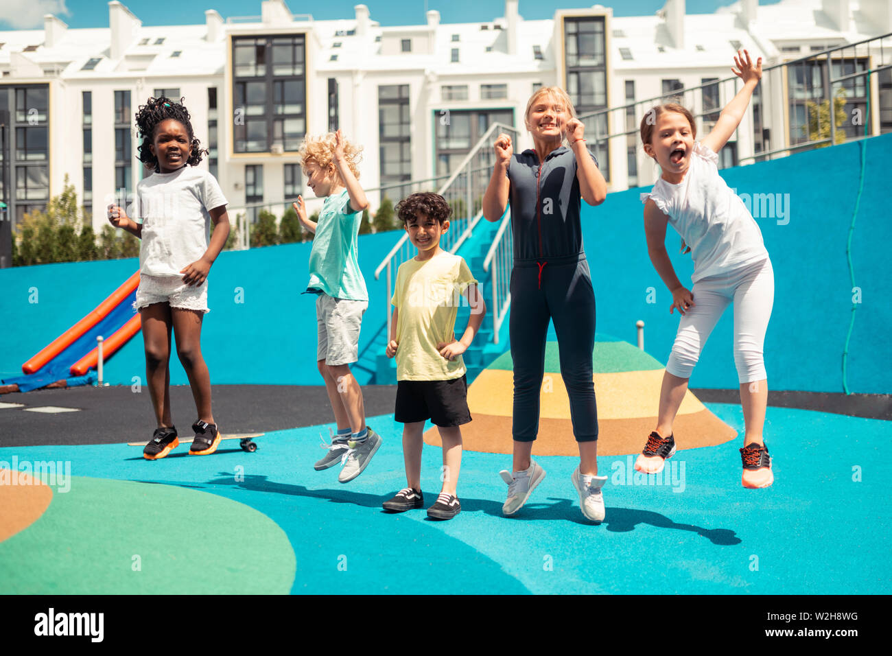 School children jumping outdoors hi-res stock photography and images ...