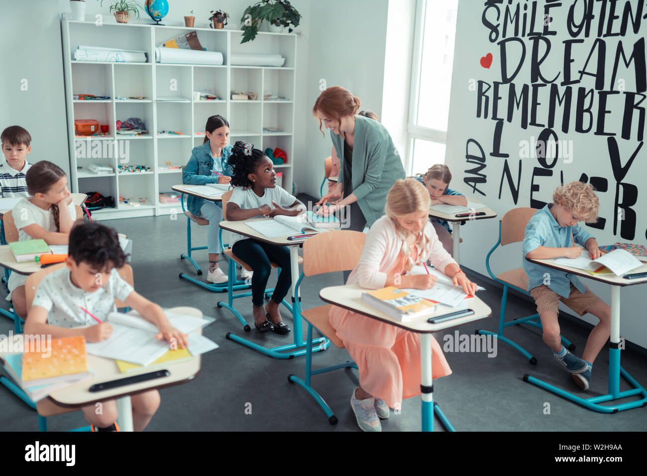 Class of children working on their task during the lesson Stock Photo ...