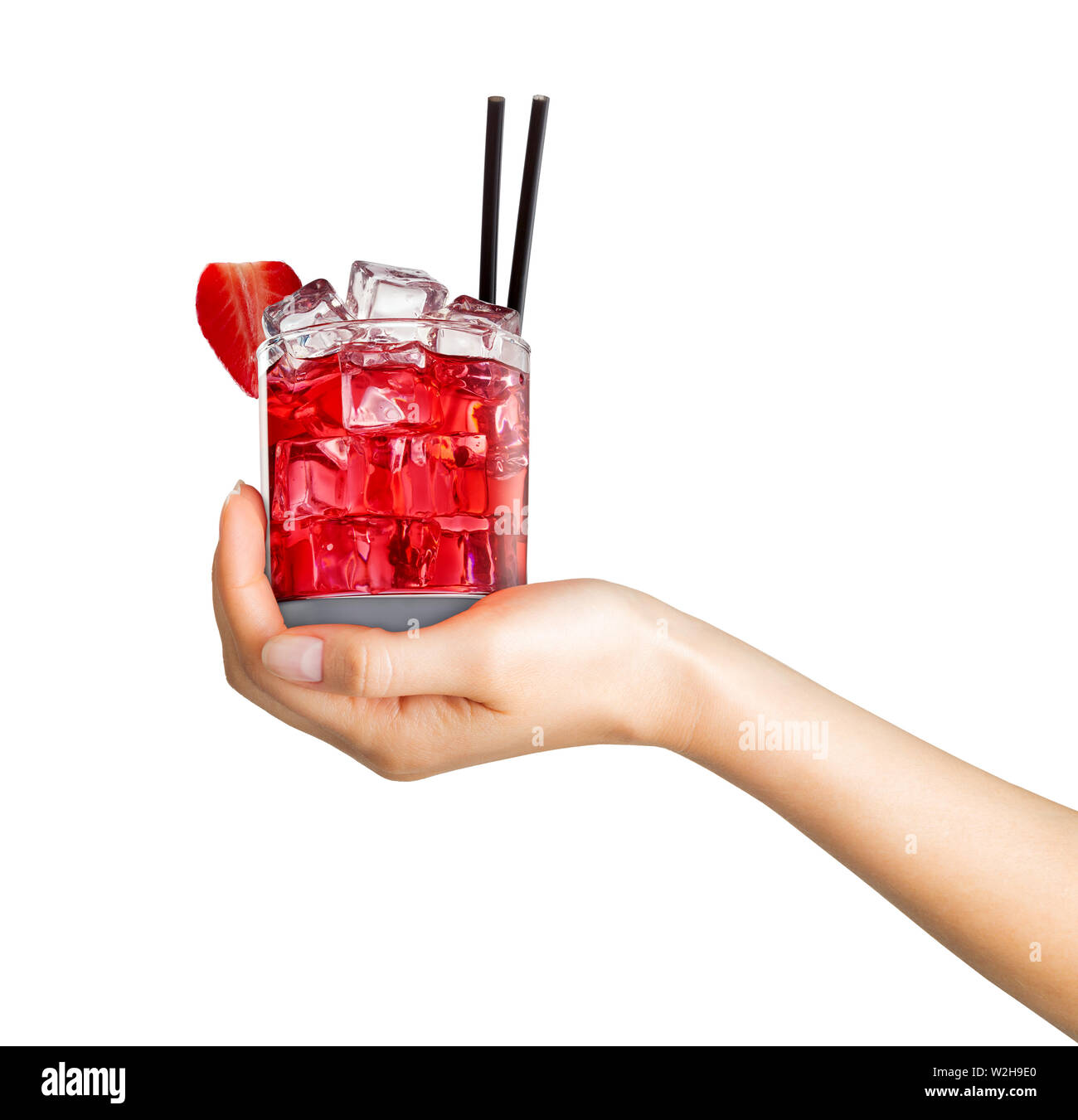 Woman hand holding cocktail in old fashioned glass with black straw ...