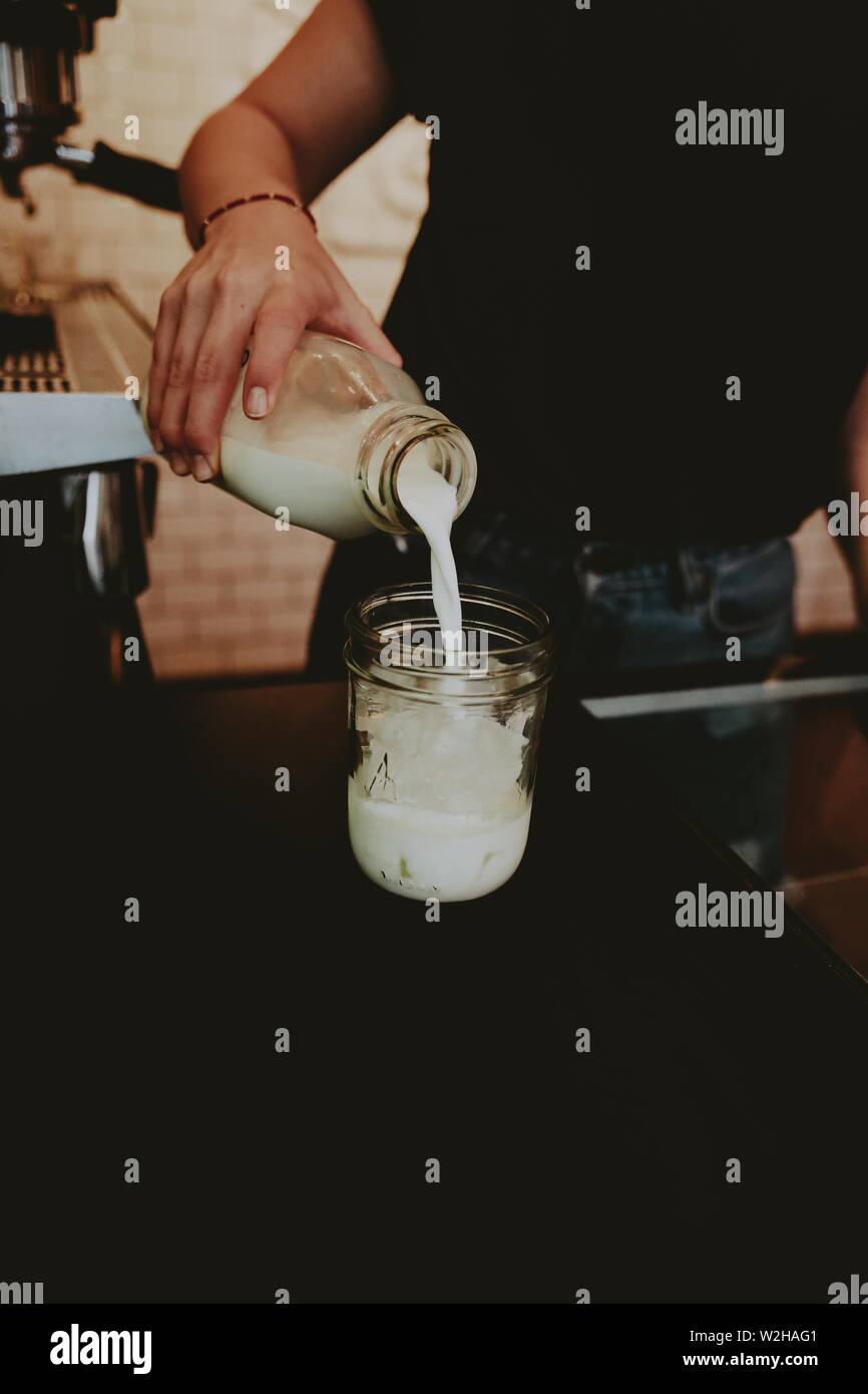 Girl pouring cream hi-res stock photography and images - Alamy