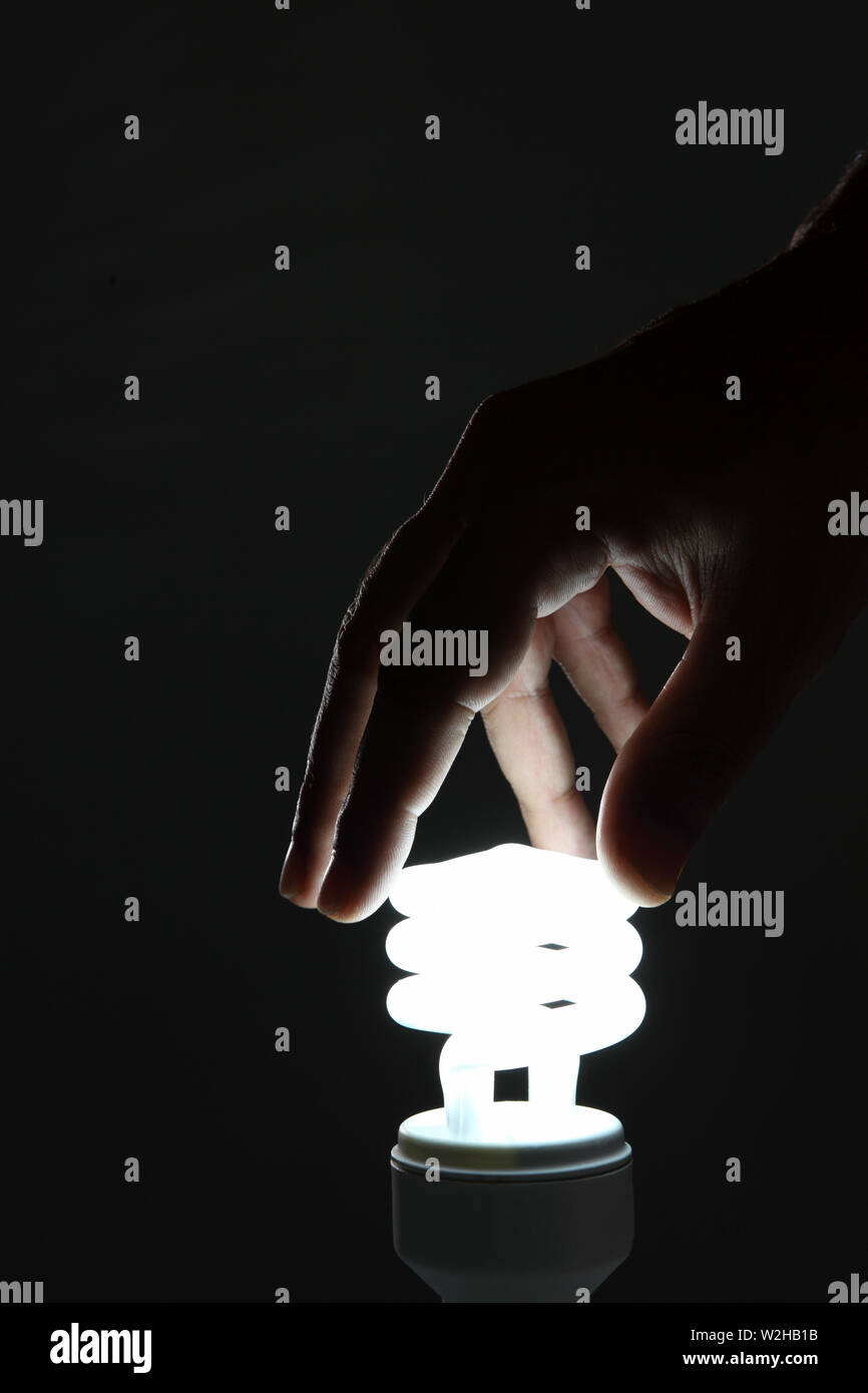 Hand changing light bulb close hi-res stock photography and images - Alamy