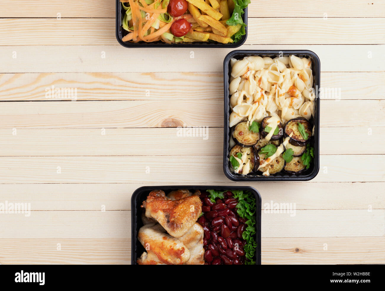Three lunch boxes with ready meal to eat Stock Photo - Alamy