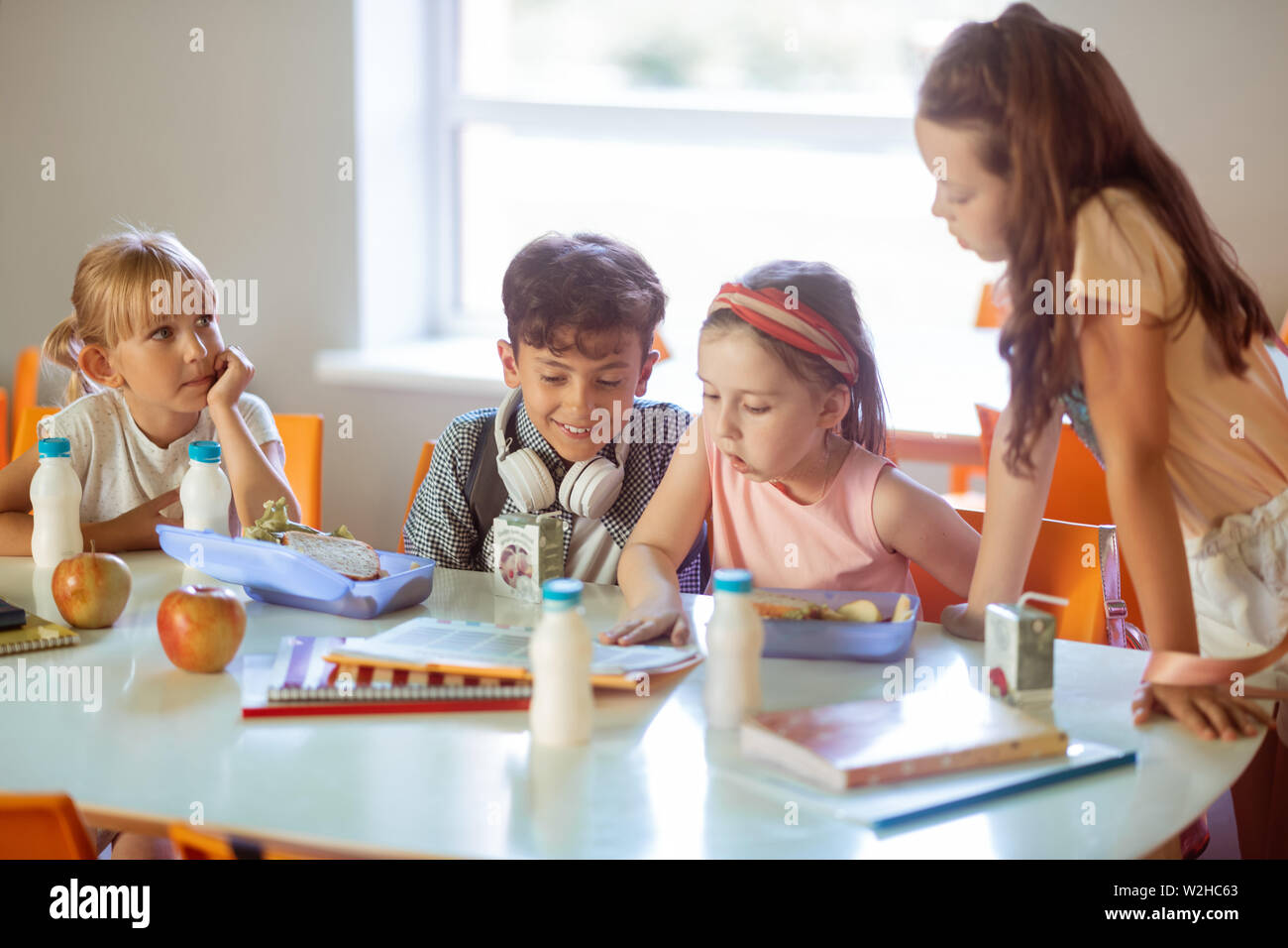 Children feeling good while spending time in canteen together Stock ...