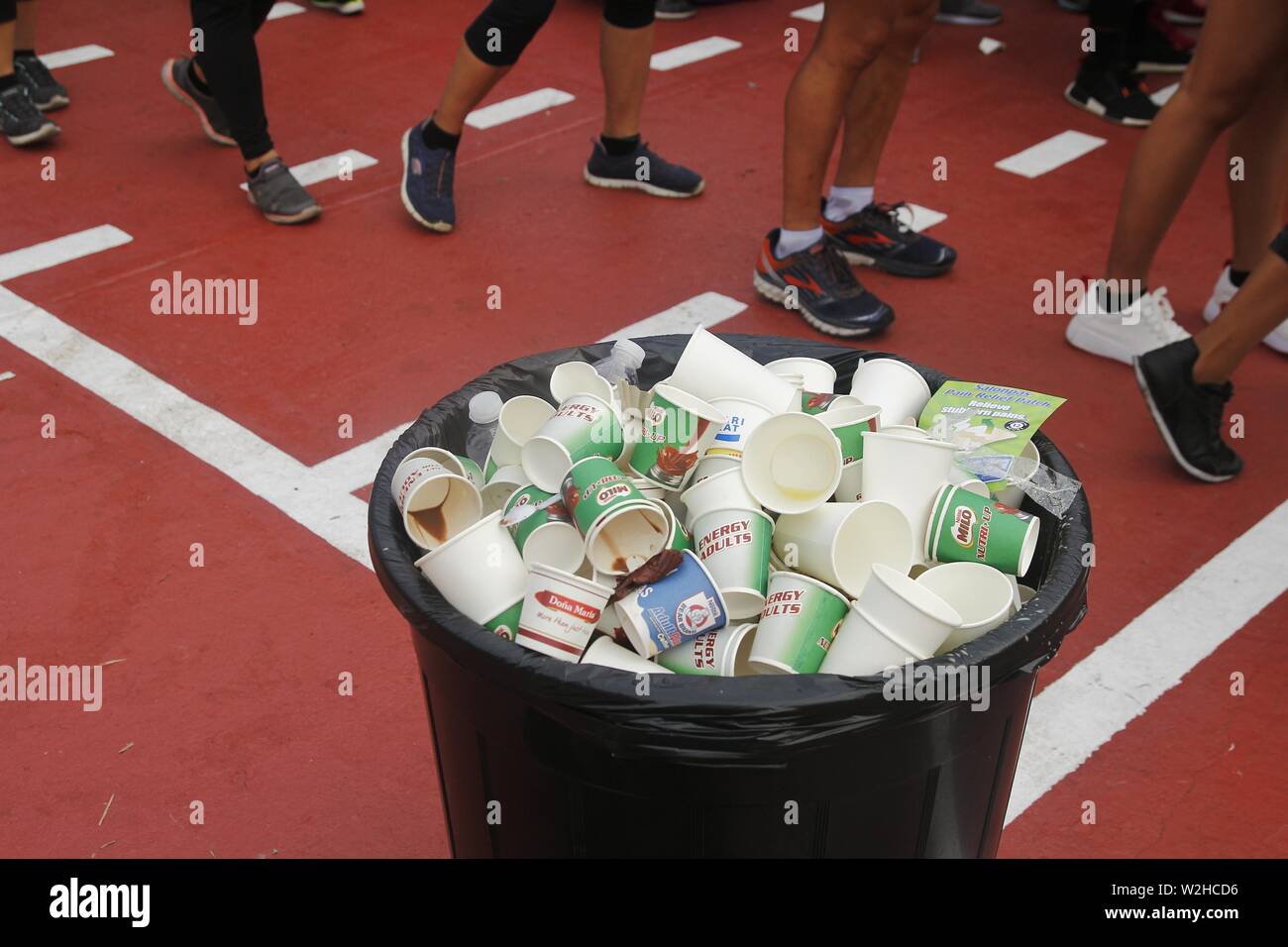 QUEZON CITY, PHILIPPINES – JULY 7, 2019: Plastic and paper cups in a ...