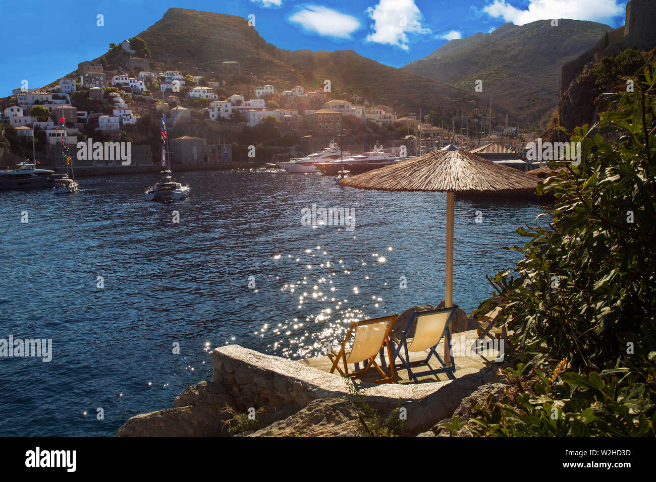 View of the sunbathing area and Hydra Harbor and town. Sunbathing area ...