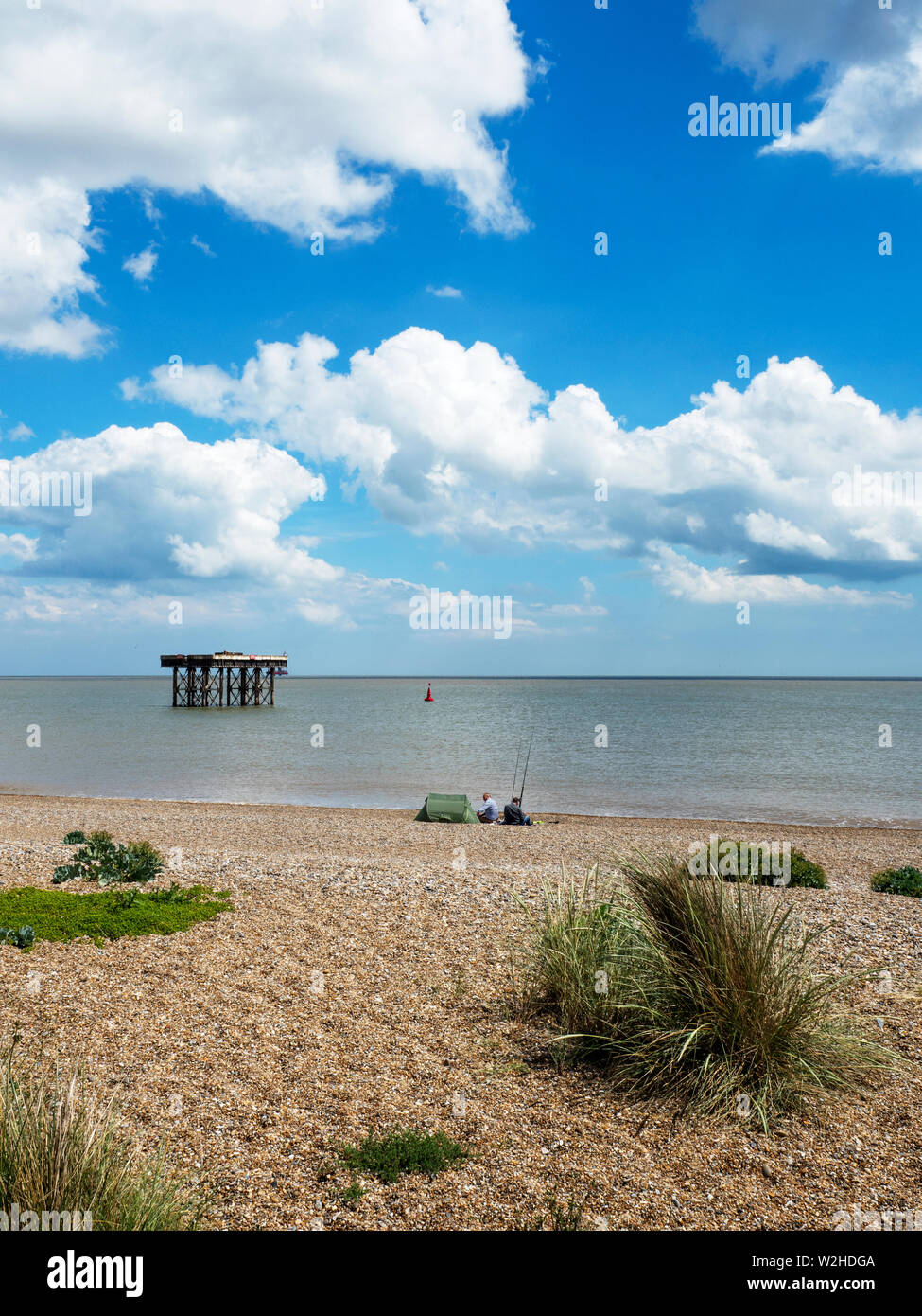 Fishing from the beach near one of the offshore platforms at Sizewell ...