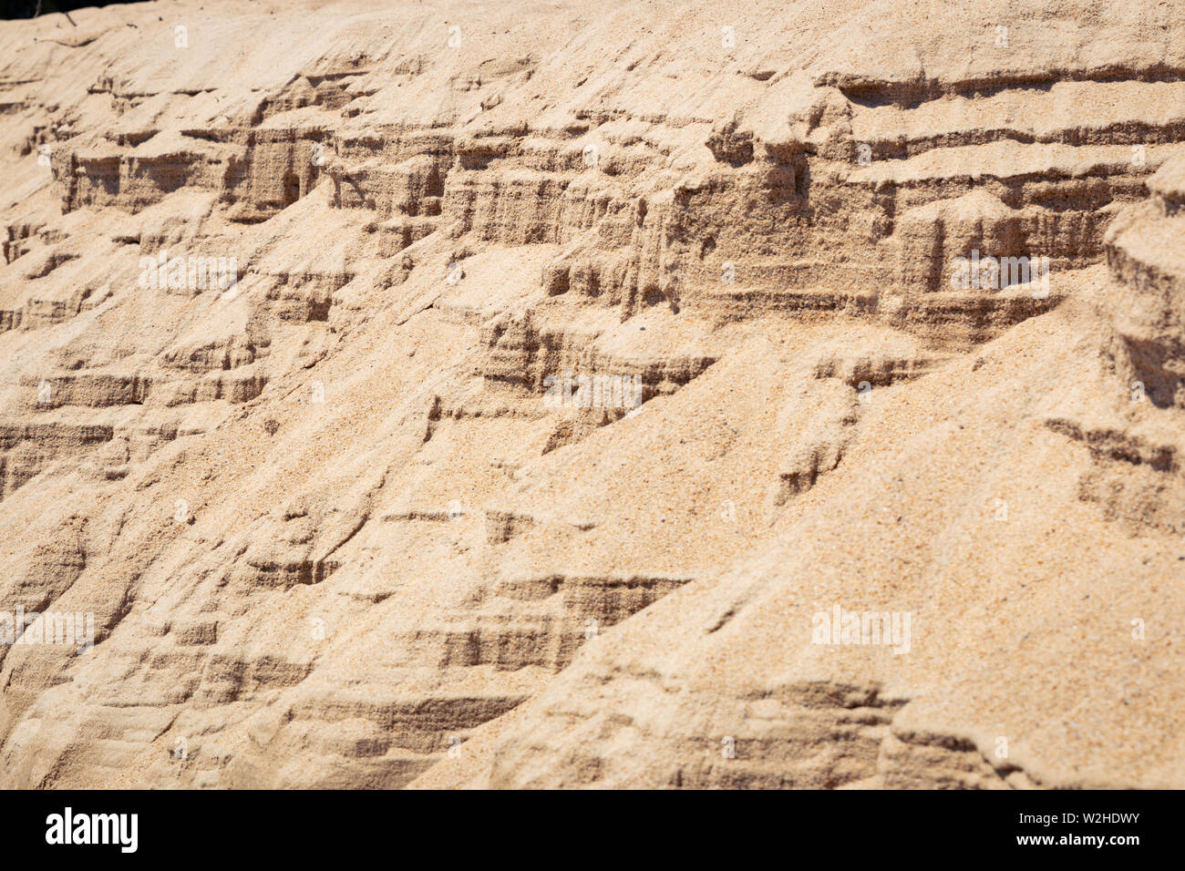 Warm colors background. Yellow sandstone textured mountain, white thin ...