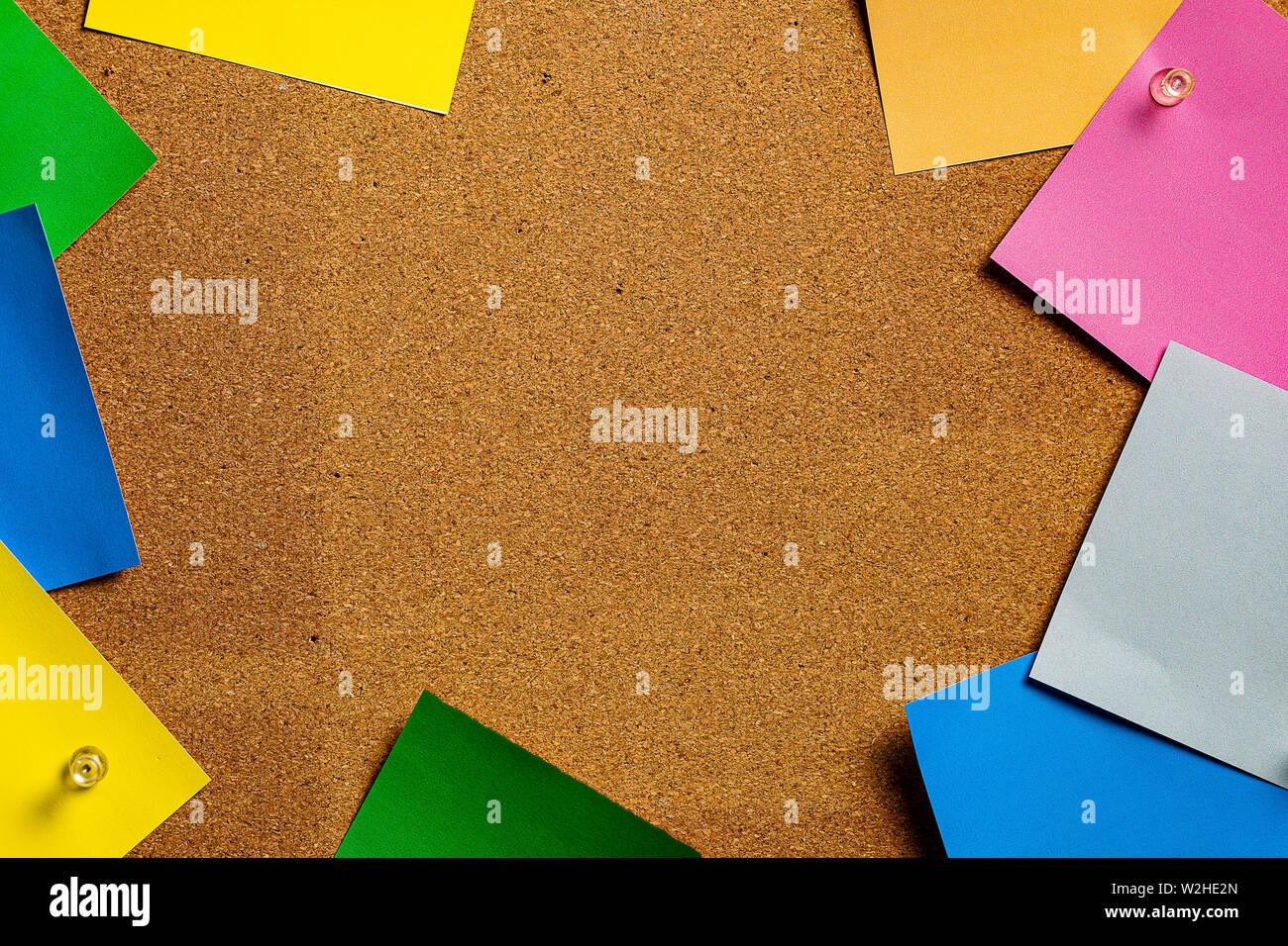 Corkboard/Bulletin Board with a group of various colored sticky notes ...