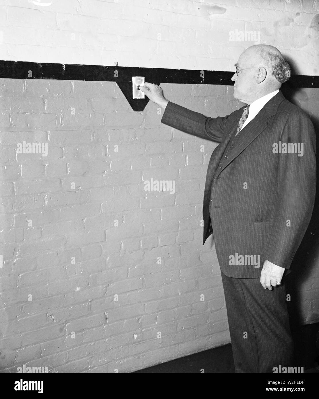 Man pushing a button ca. 1936 Stock Photo - Alamy