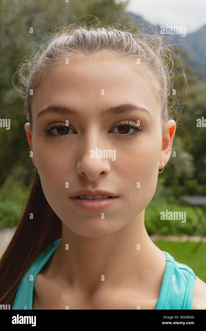 Beautiful female trainer standing in the backyard Stock Photo - Alamy
