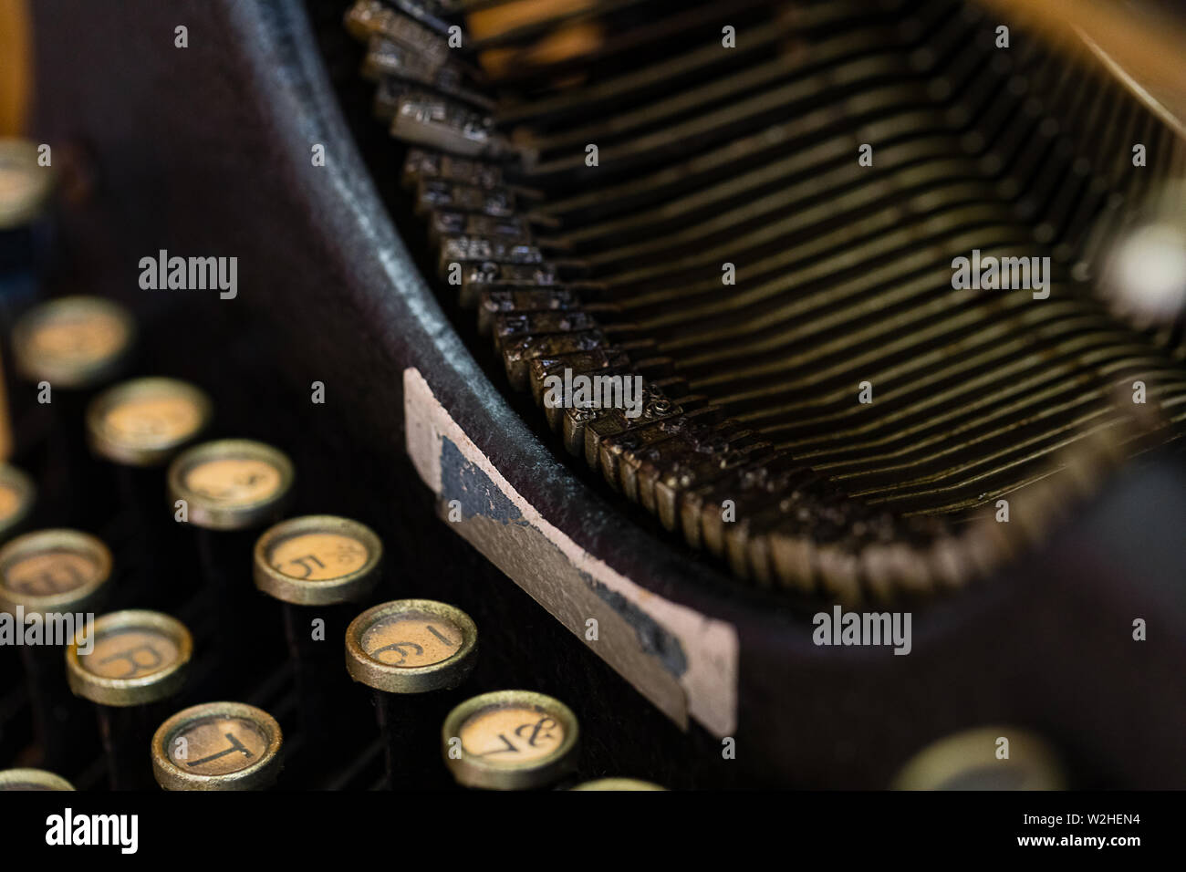 A Close-up image of a vintage typewriter Keyboard and Striker bar ...