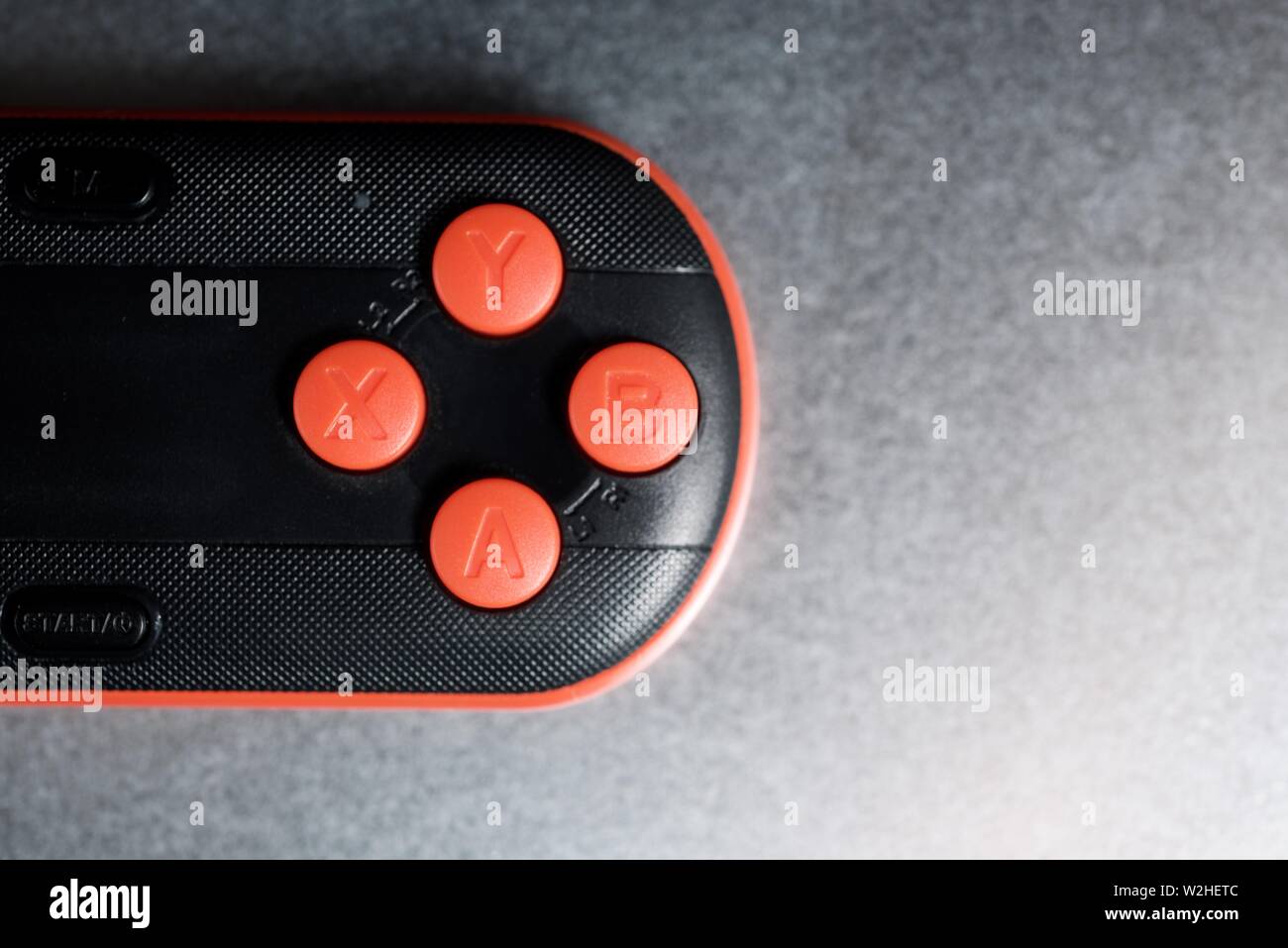 Remote control on a metal surface Stock Photo - Alamy