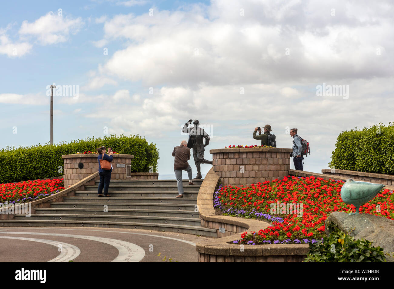 Bronze statue of famous English comedian Eric Morecambe at the seafront ...