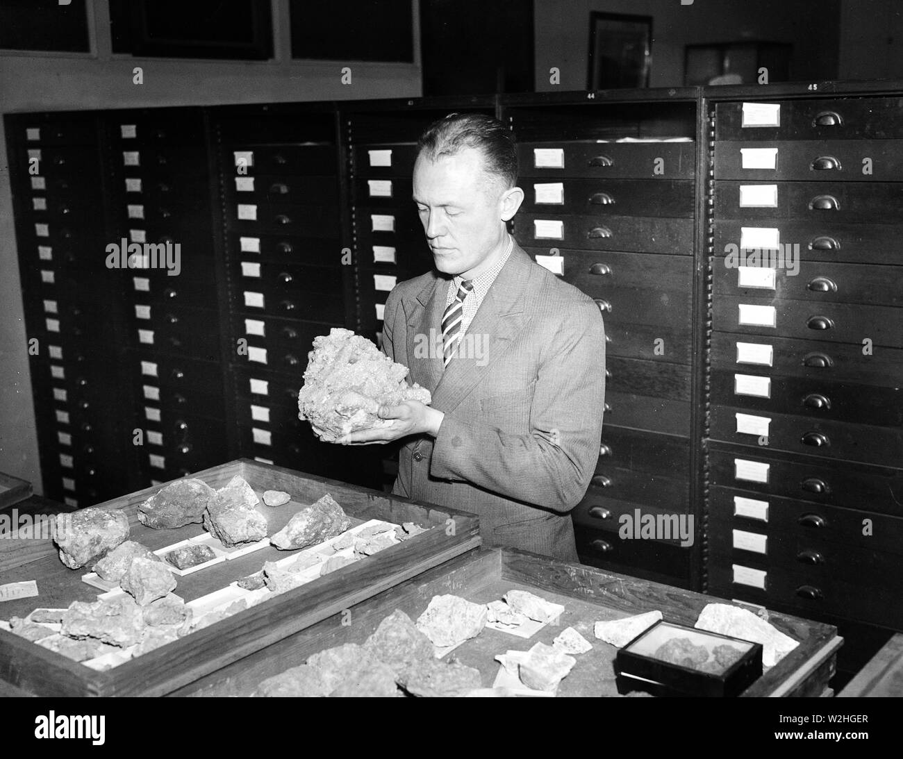 Examining a rock hi-res stock photography and images - Alamy