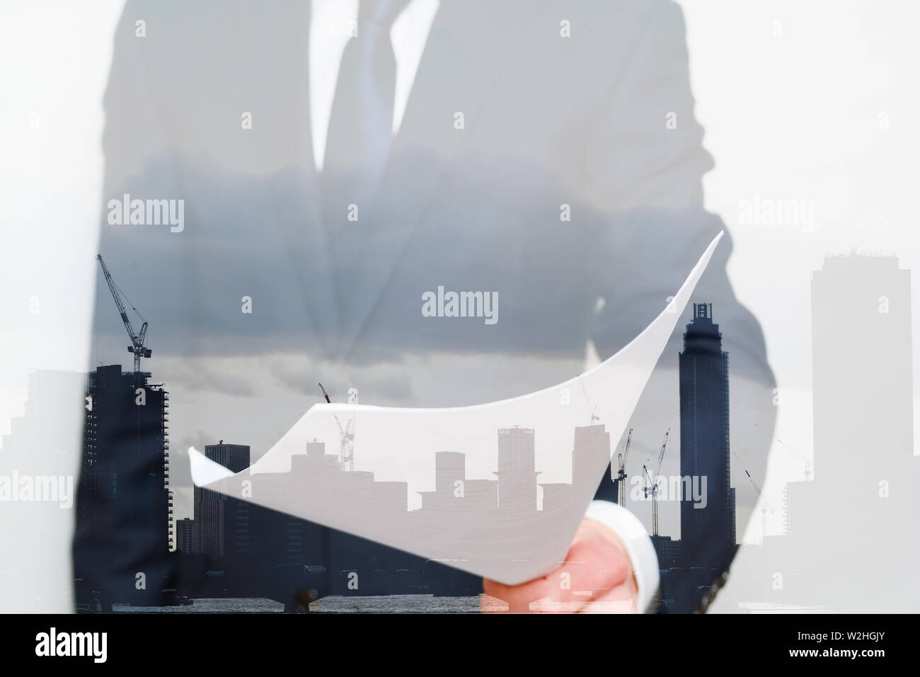 Business Deal, man in business suit holding a contract in front of ...