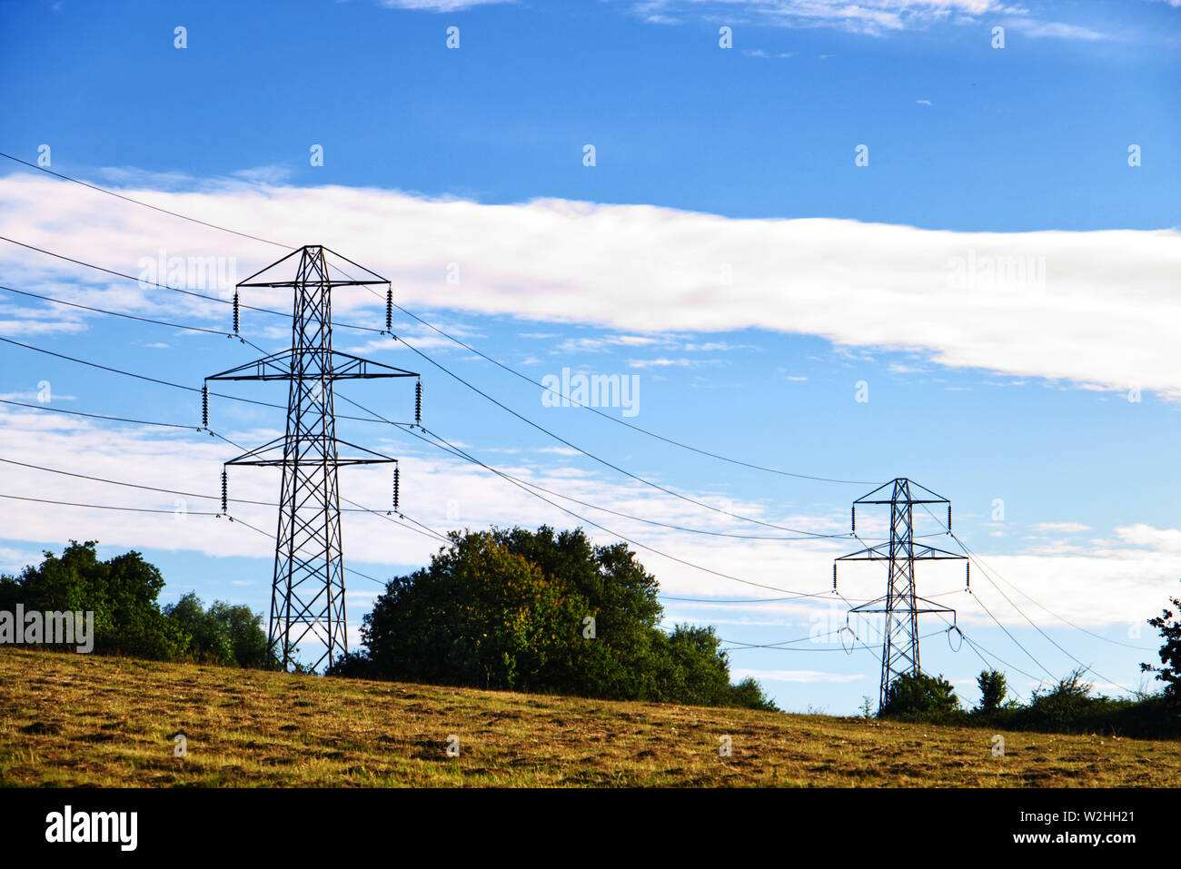 Electricity pylons among fields in the English countryside Stock Photo ...