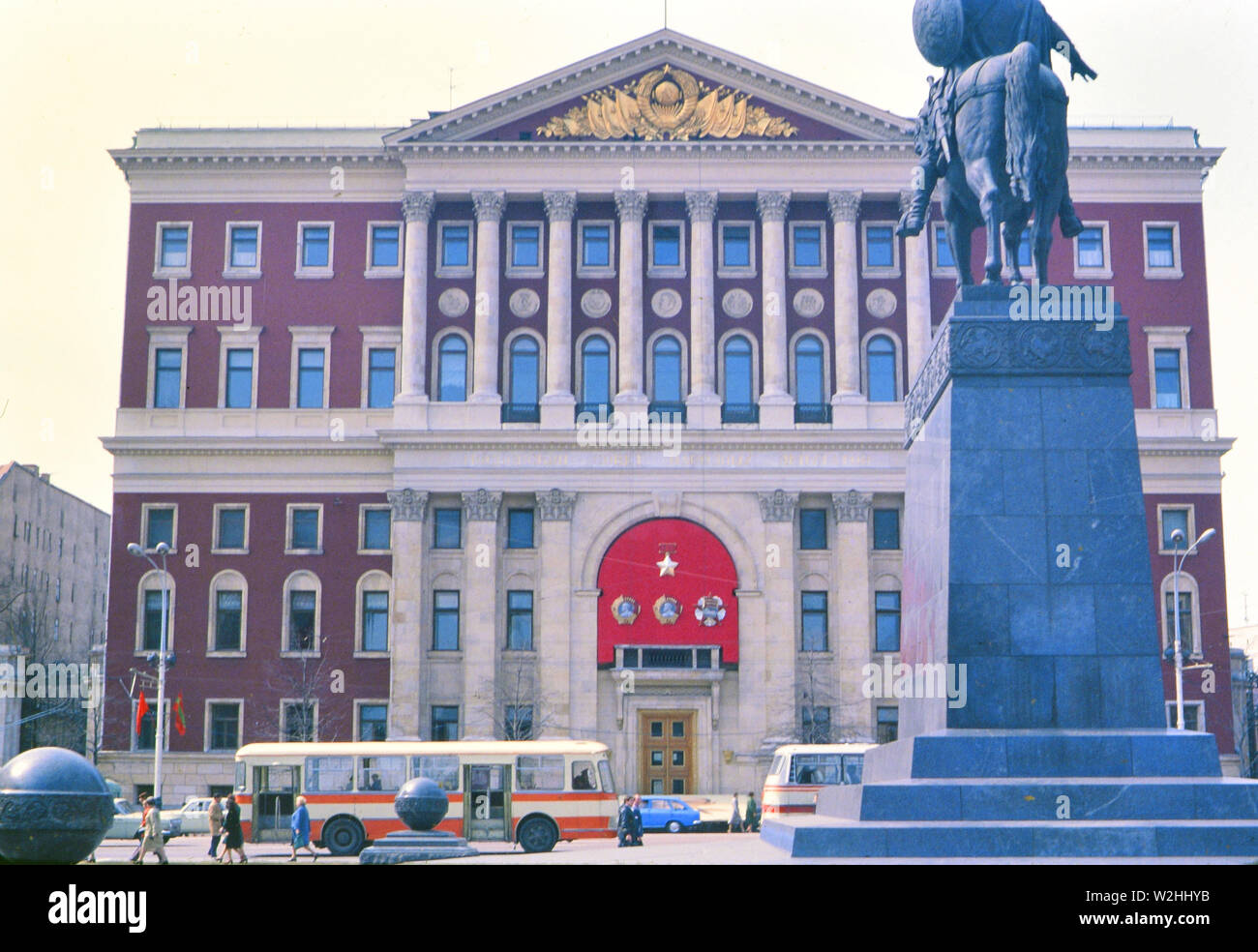 1970s Russia - A street scene with pedestrians and a bus in front of a ...