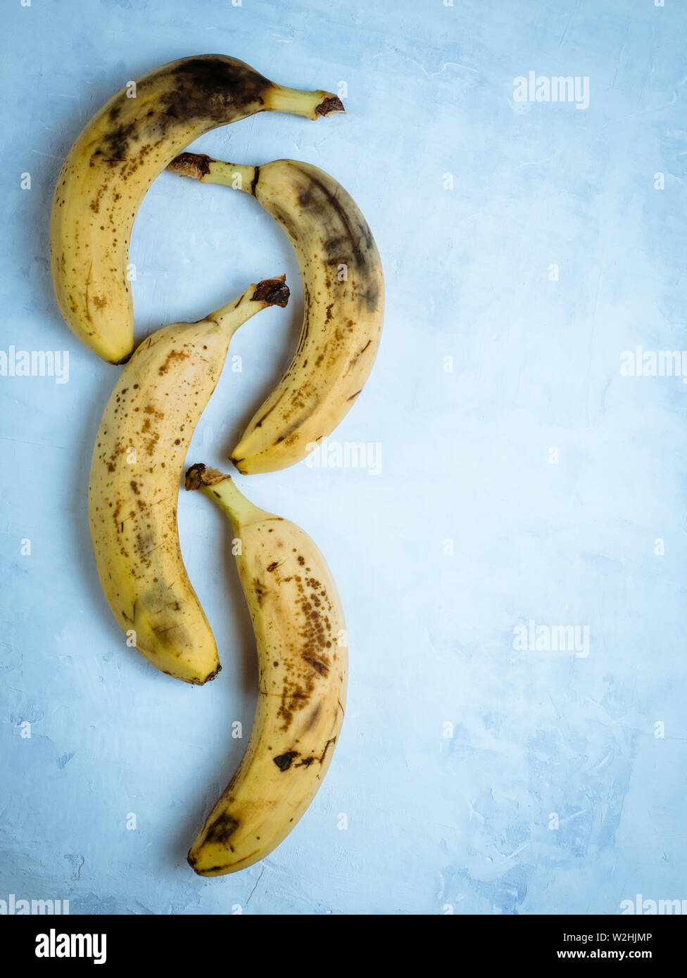 Old banana on light blue background. Zero waste concept. Save the lone ...
