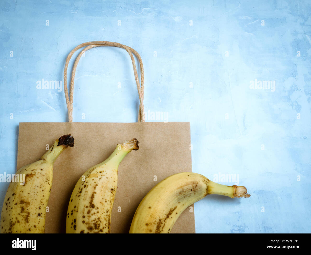 Old banana on light blue background. Zero waste concept. Save the lone ...
