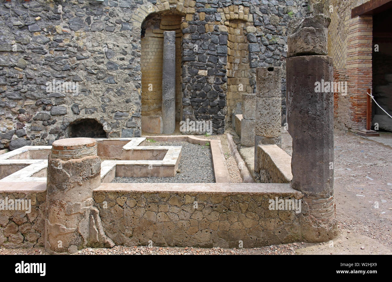 Old ancient architecture site with stone wall and columns from Roman ...
