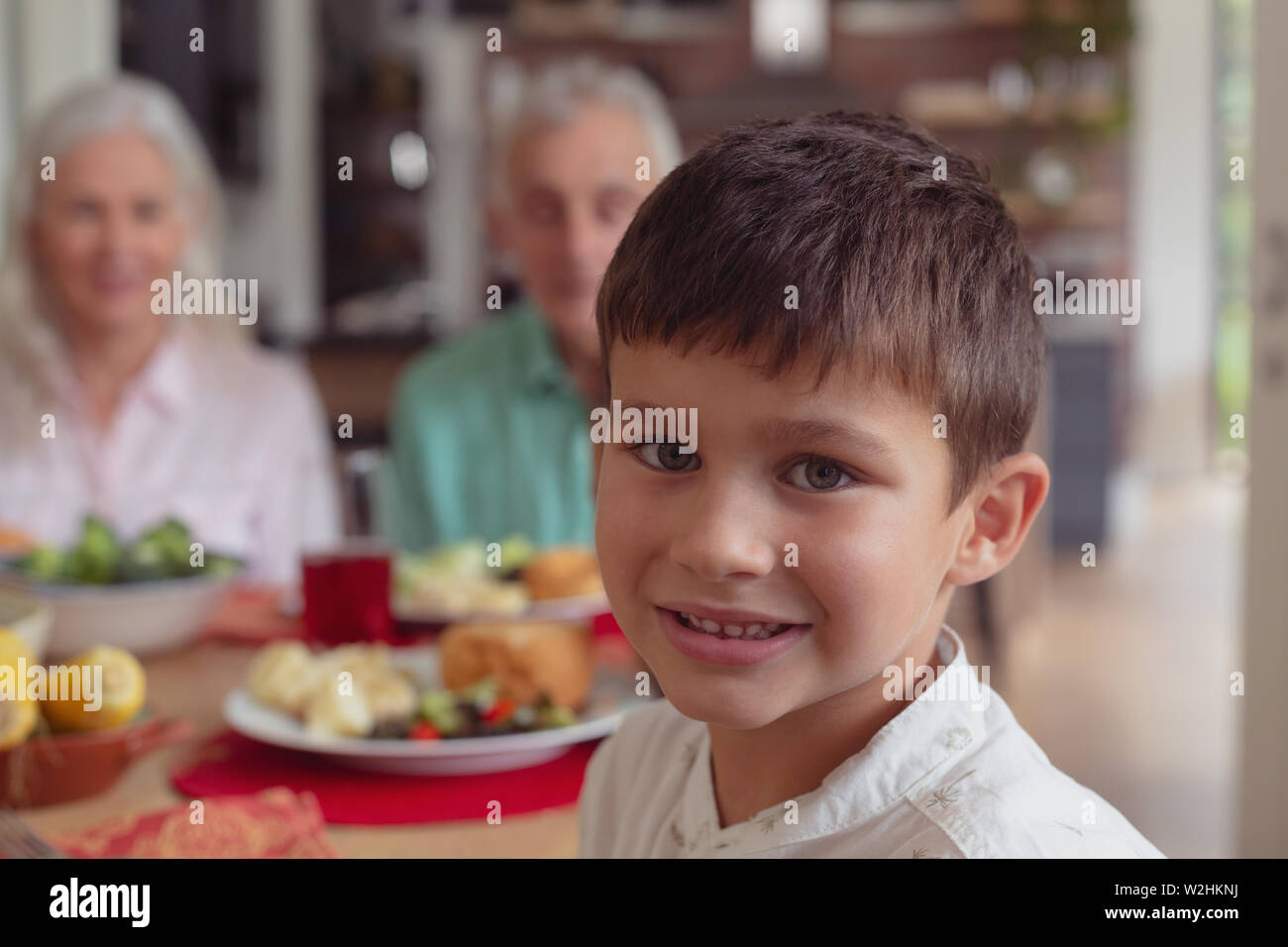 Boy at dining table hi-res stock photography and images - Alamy