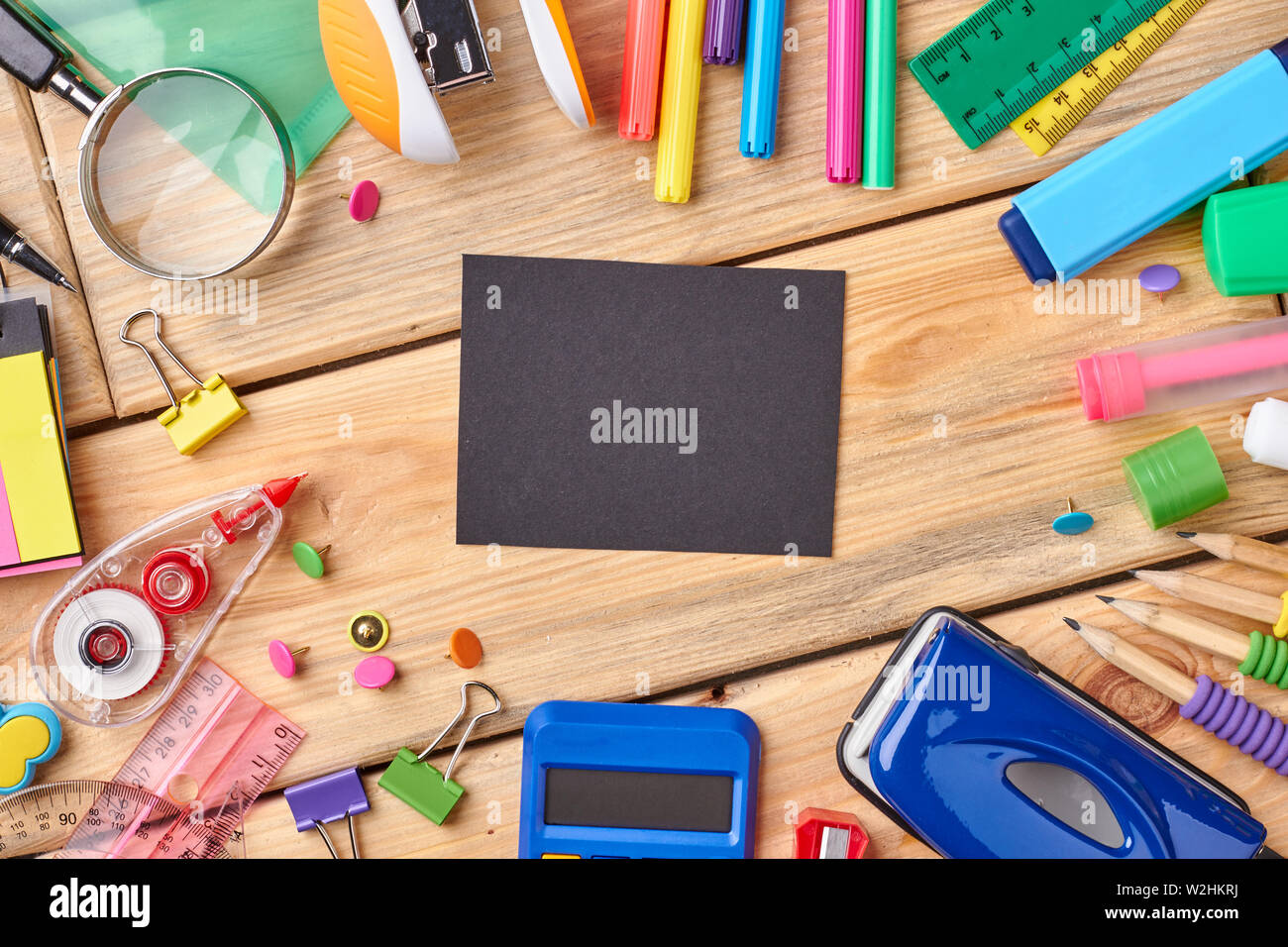 Office and student accessories on wooden background Stock Photo - Alamy