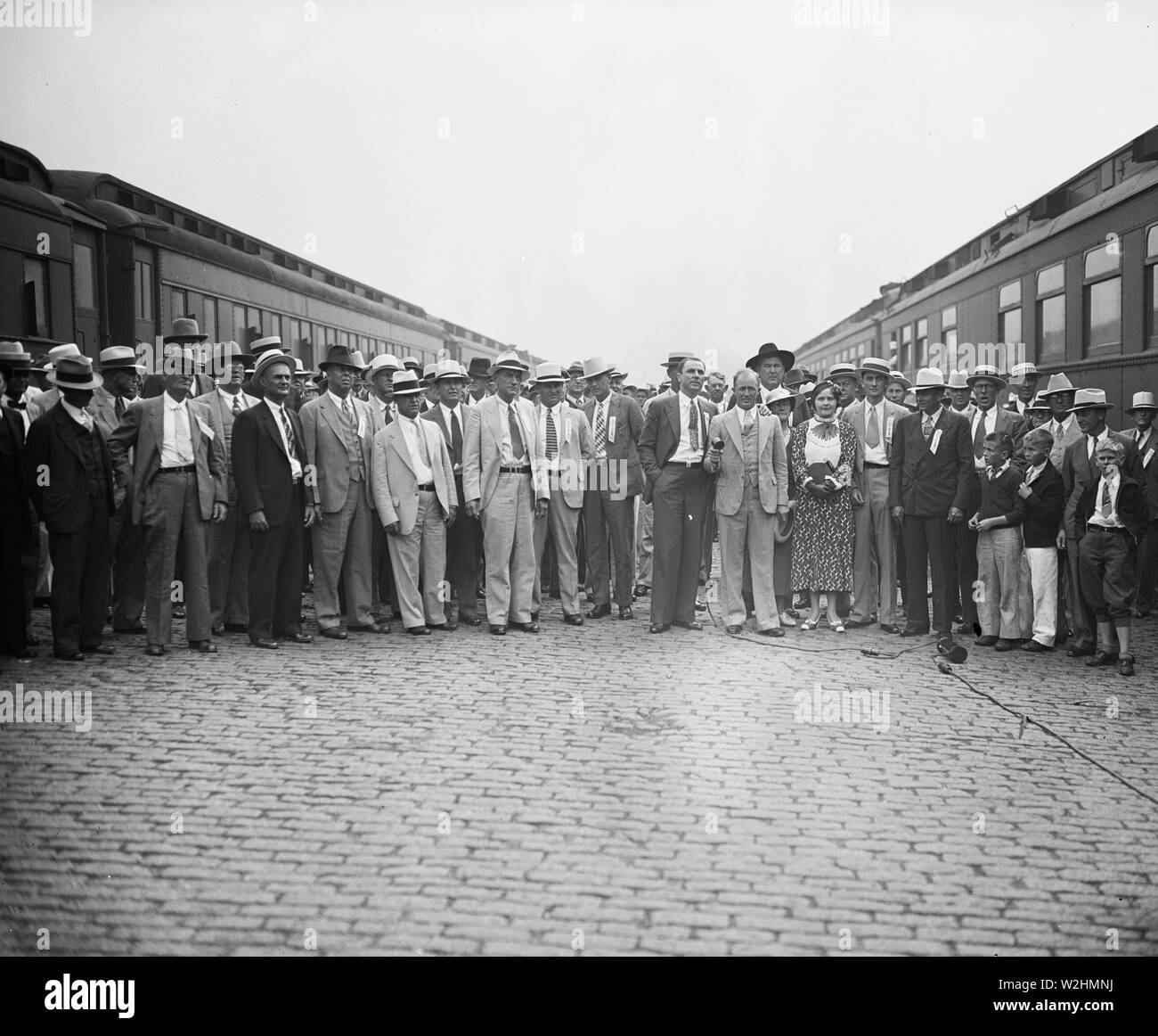Group men standing near Black and White Stock Photos & Images - Alamy