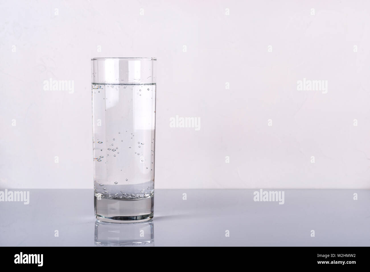 Glass of water on white background Stock Photo - Alamy