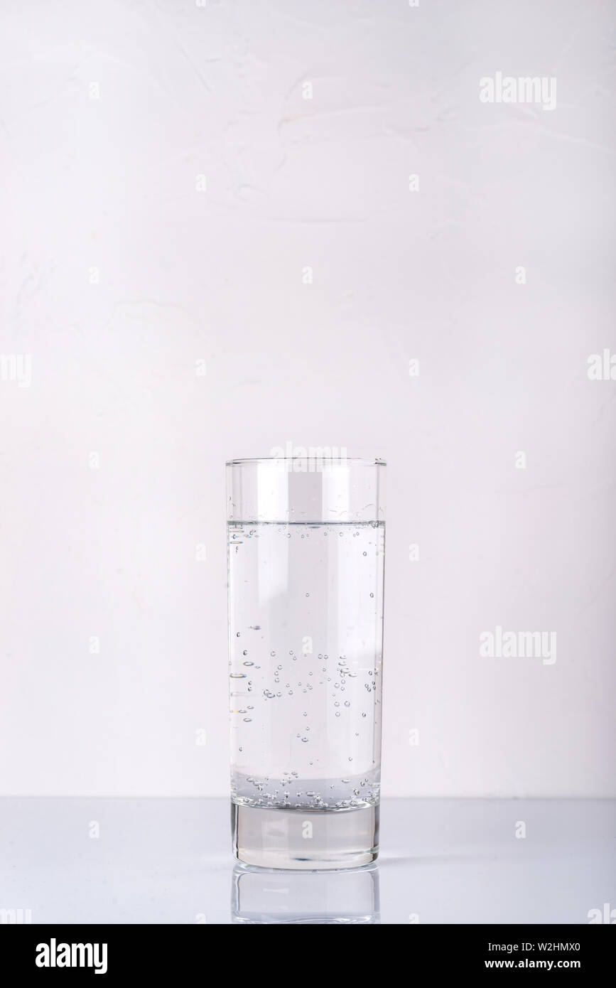 Glass of water on white background Stock Photo - Alamy