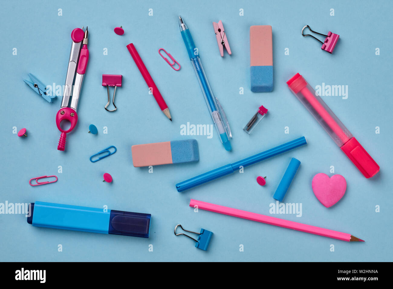 Colorful school supplies on blue background Stock Photo - Alamy