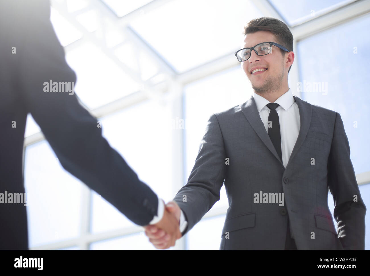 handshake of business partners .bottom view Stock Photo - Alamy
