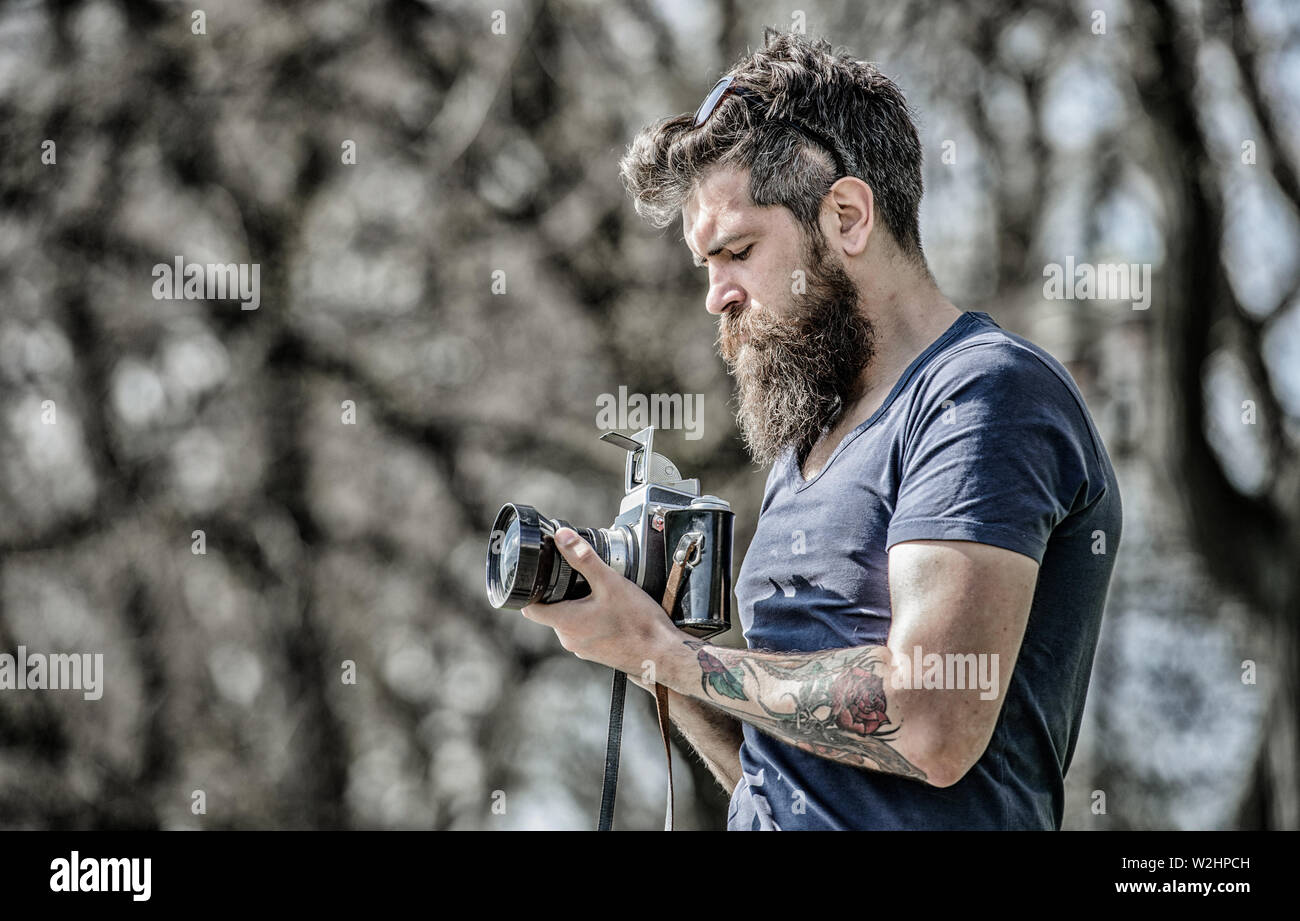 Modern blogger. Content creator. Man bearded hipster photographer ...