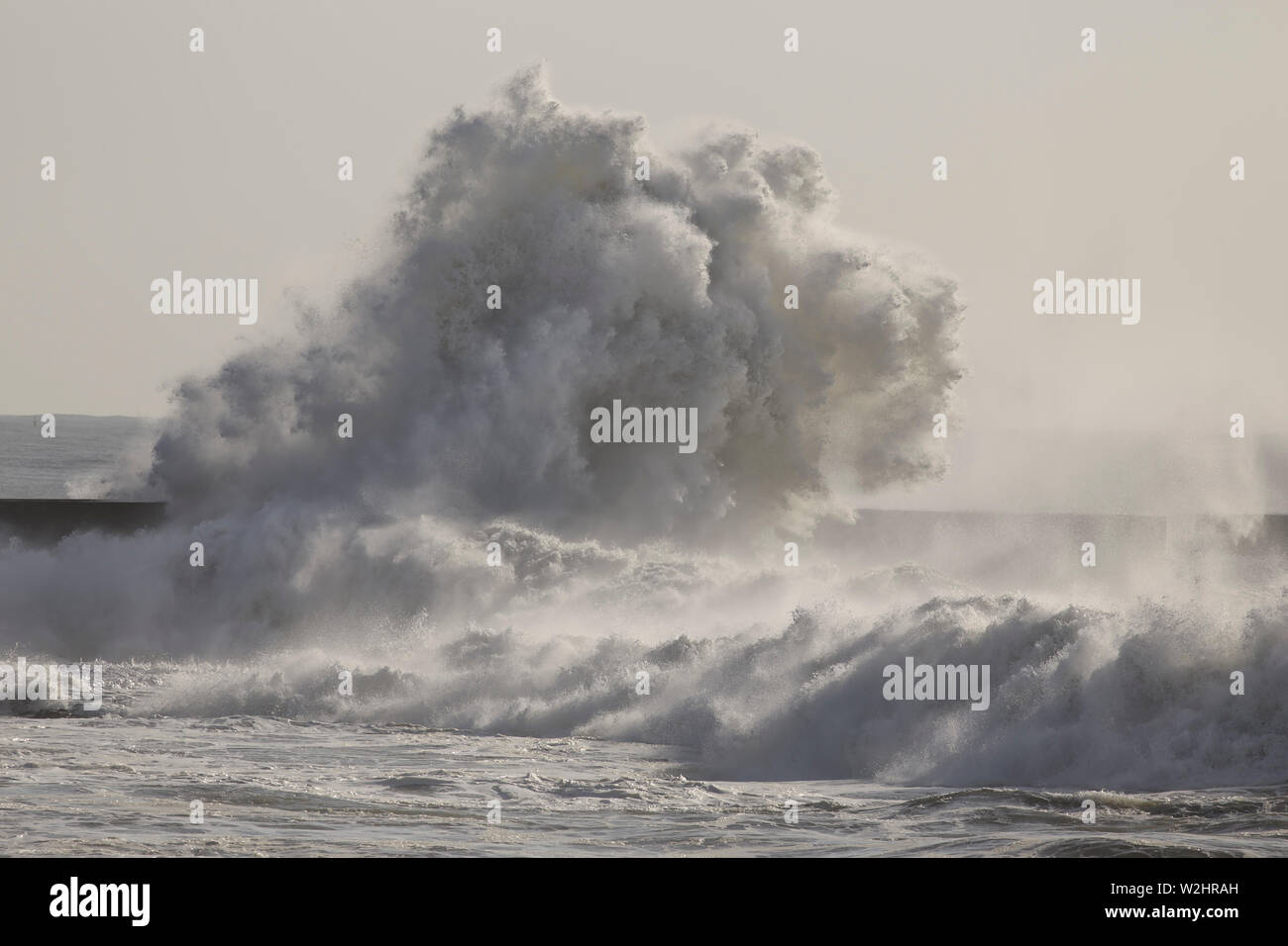 Soft backlit big wave splash Stock Photo - Alamy