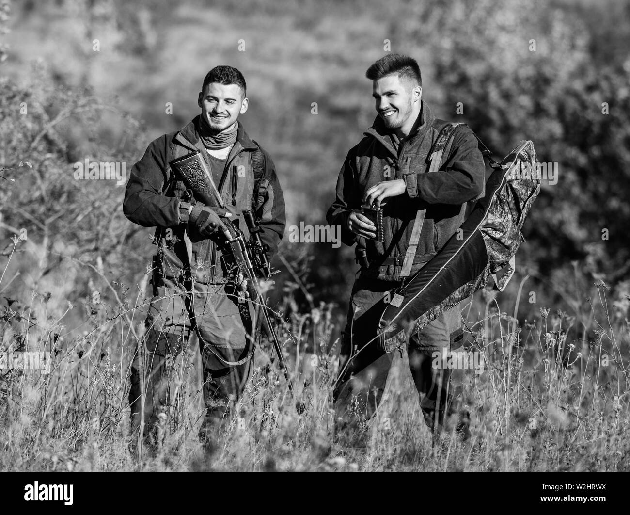 Man hunters with rifle gun. Boot camp. Hunting skills and weapon ...