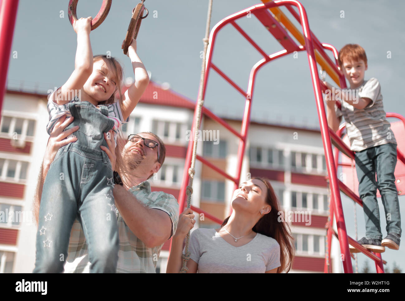 young family with children playing in the Playground Stock Photo - Alamy