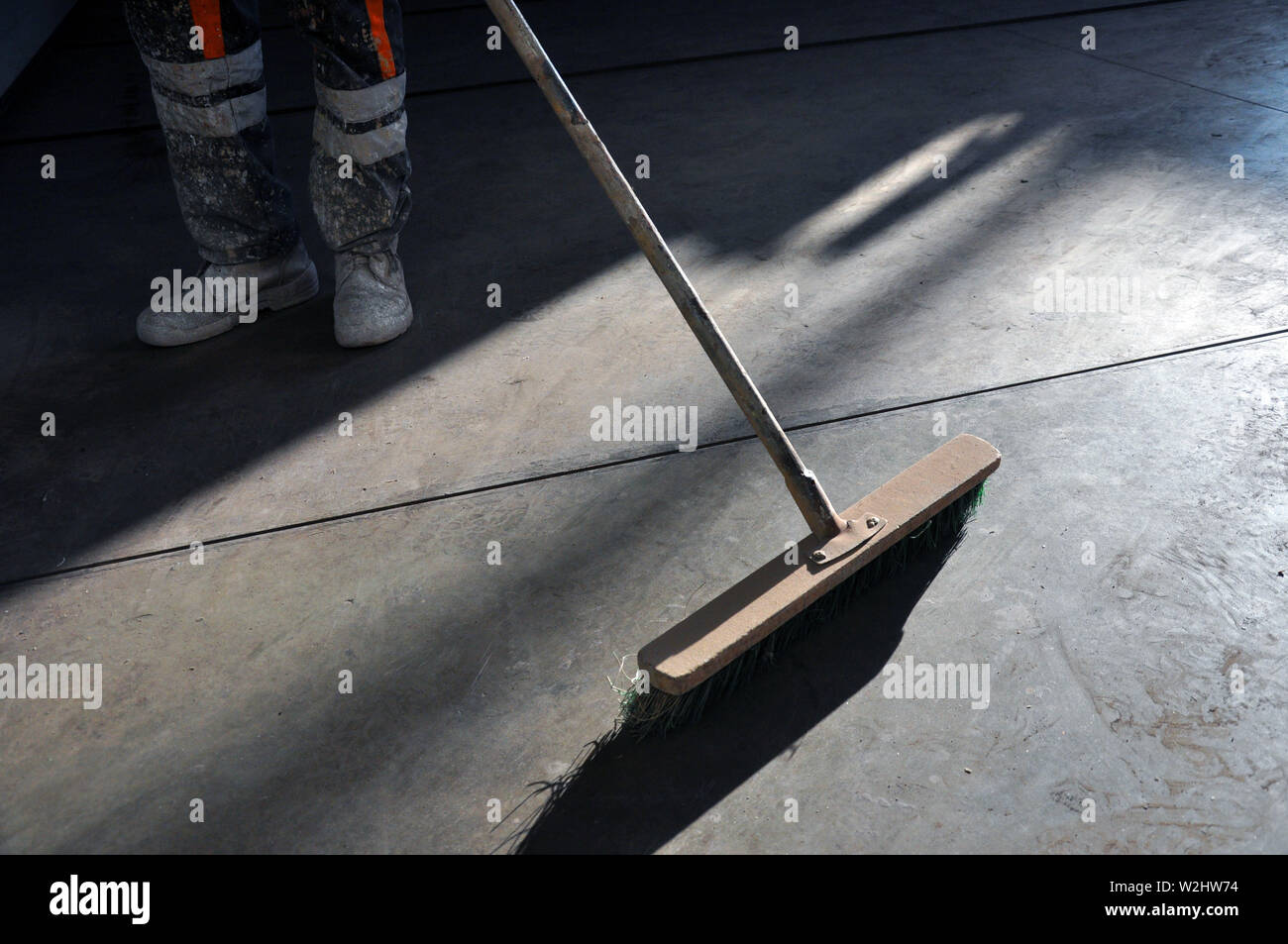 Cleaning of the production room using a brush. Manual cleaning Stock ...