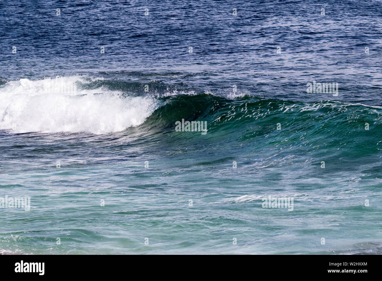 Blue waves in the ocean, this was captured in Ireland Stock Photo - Alamy