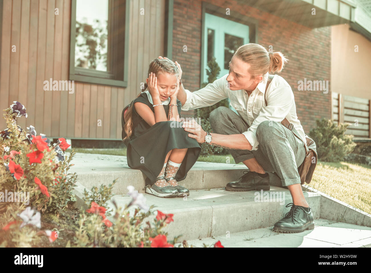 Upset little girl in black school uniform desperately crying Stock ...