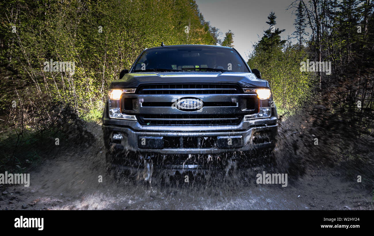 Ford F150 driving in a puddle Stock Photo - Alamy