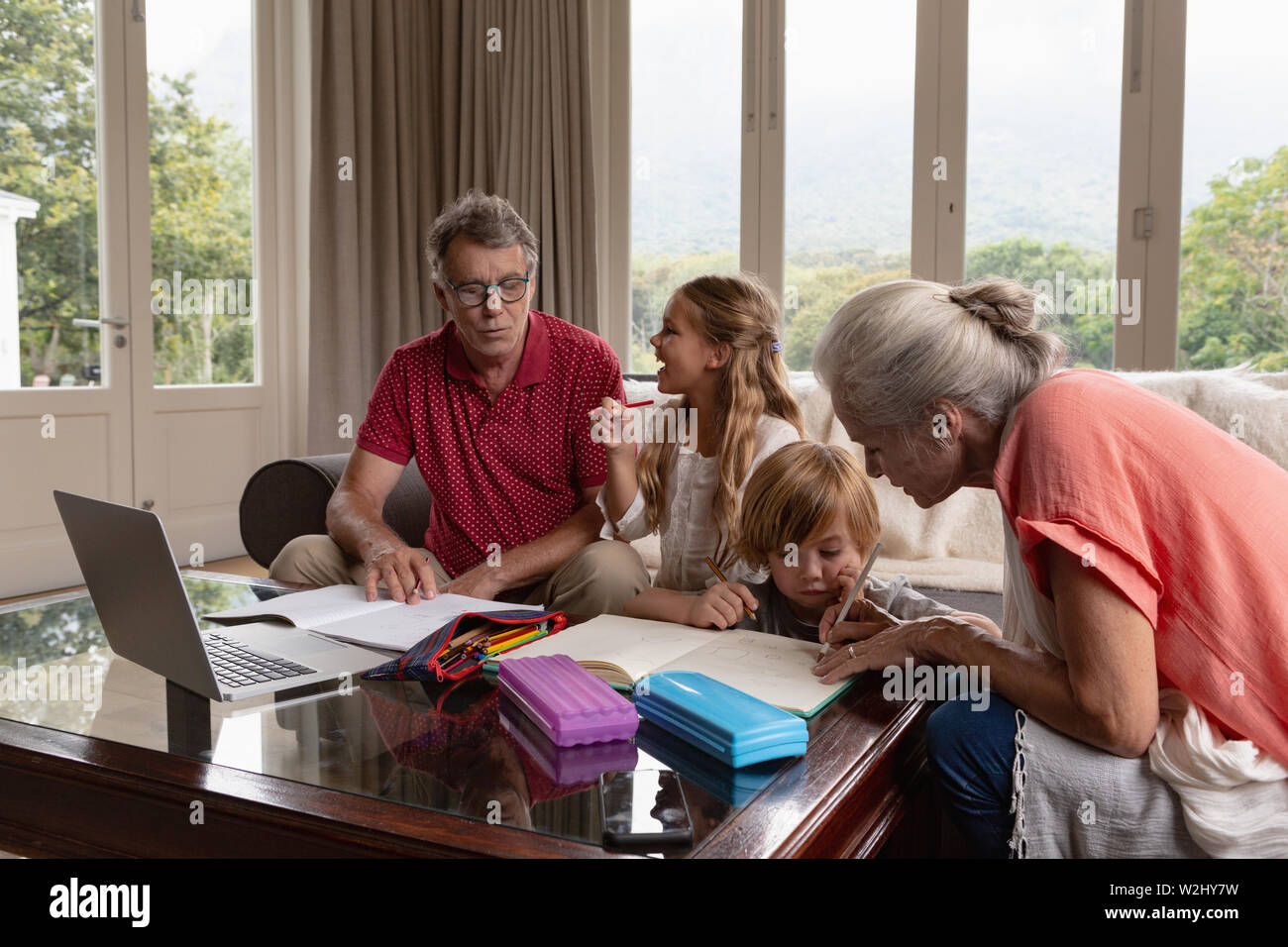 Child helping elderly hi-res stock photography and images - Alamy