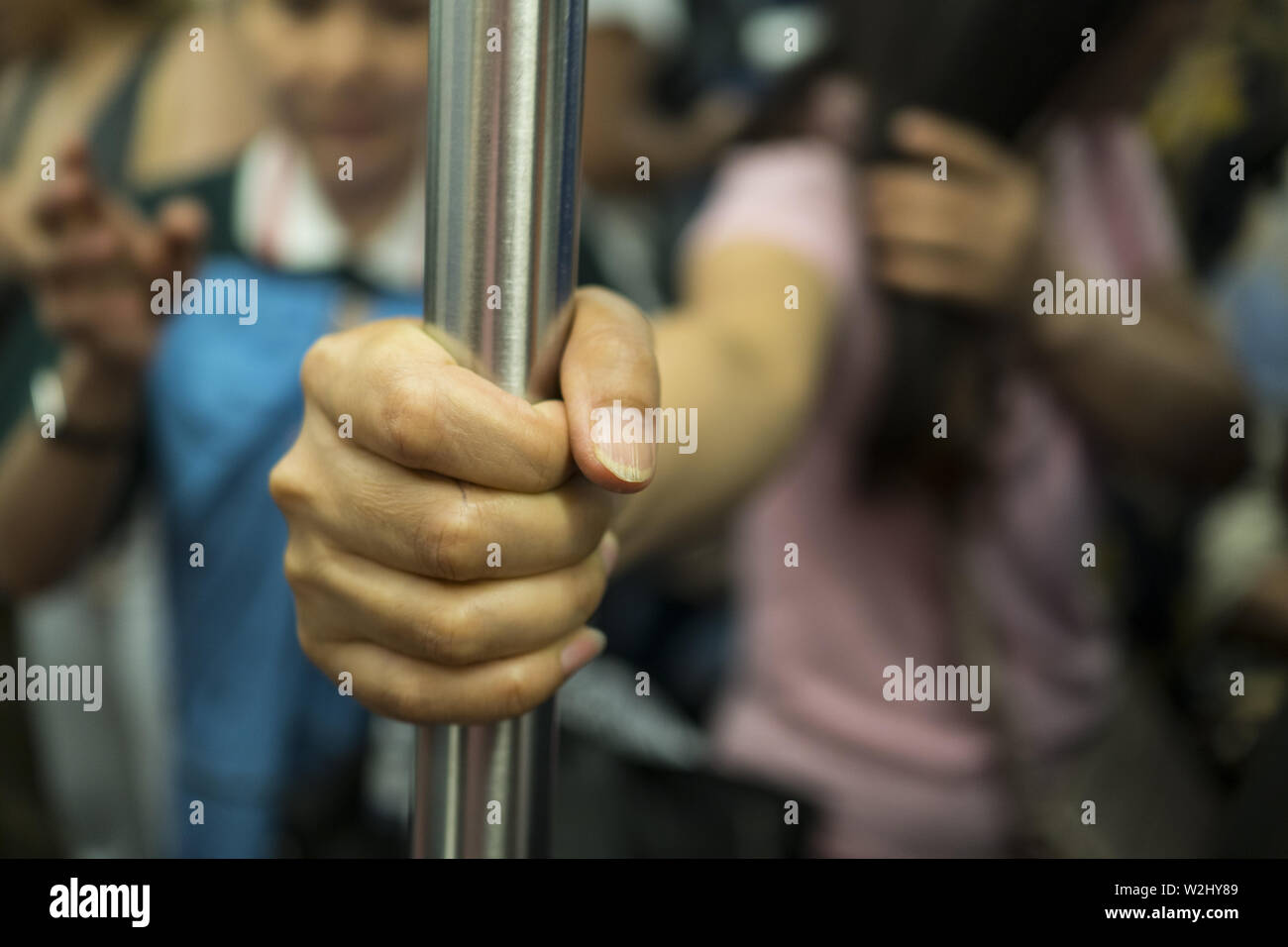 Hand grasping a pole hi-res stock photography and images - Alamy