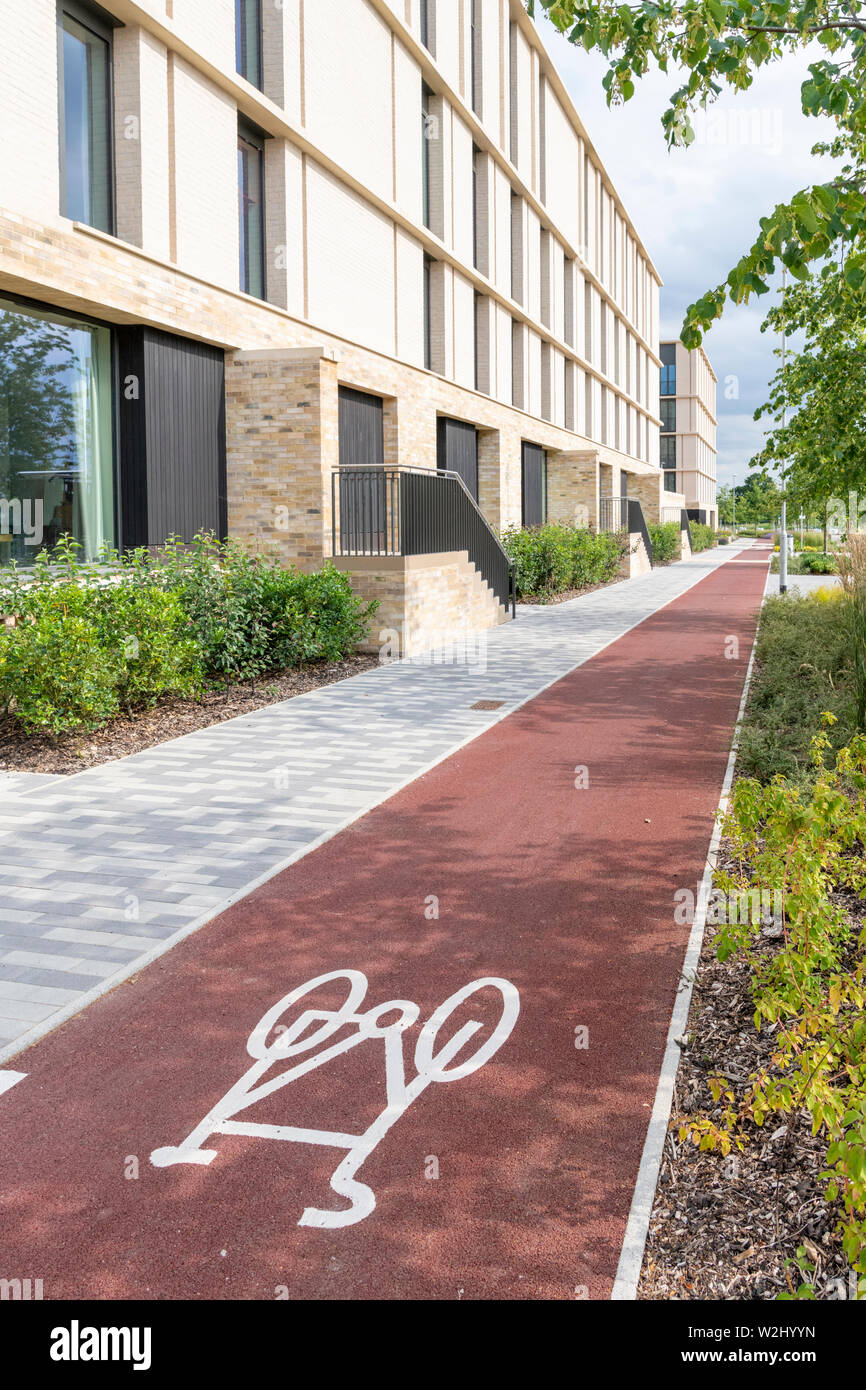 Cylce paths alongside footpaths and houses at Eddington Cambridge UK a ...