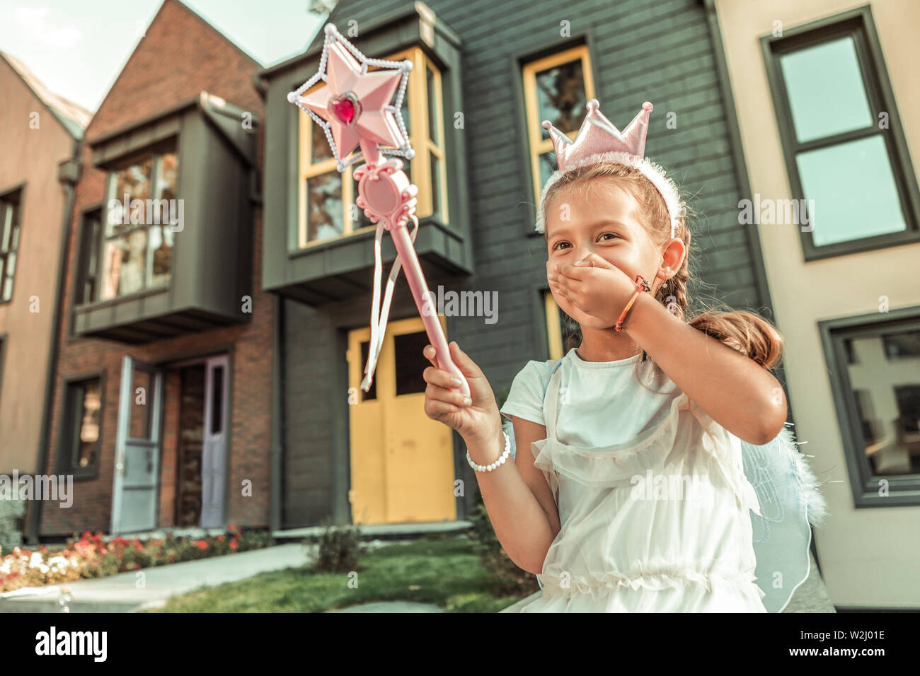Smiling cute lady carrying pink element while being a fairy Stock Photo ...