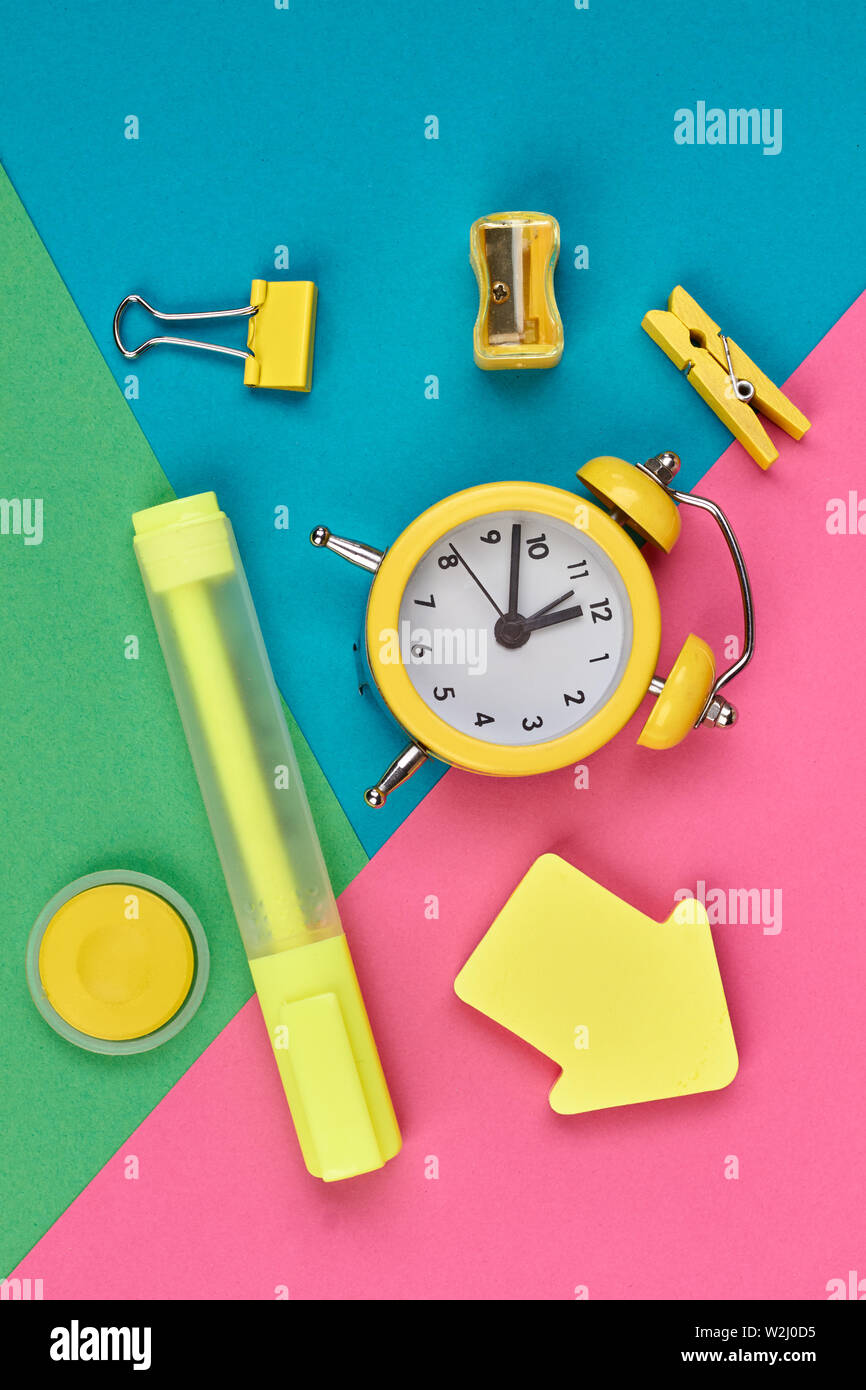 Yellow stationery supplies on color background Stock Photo - Alamy