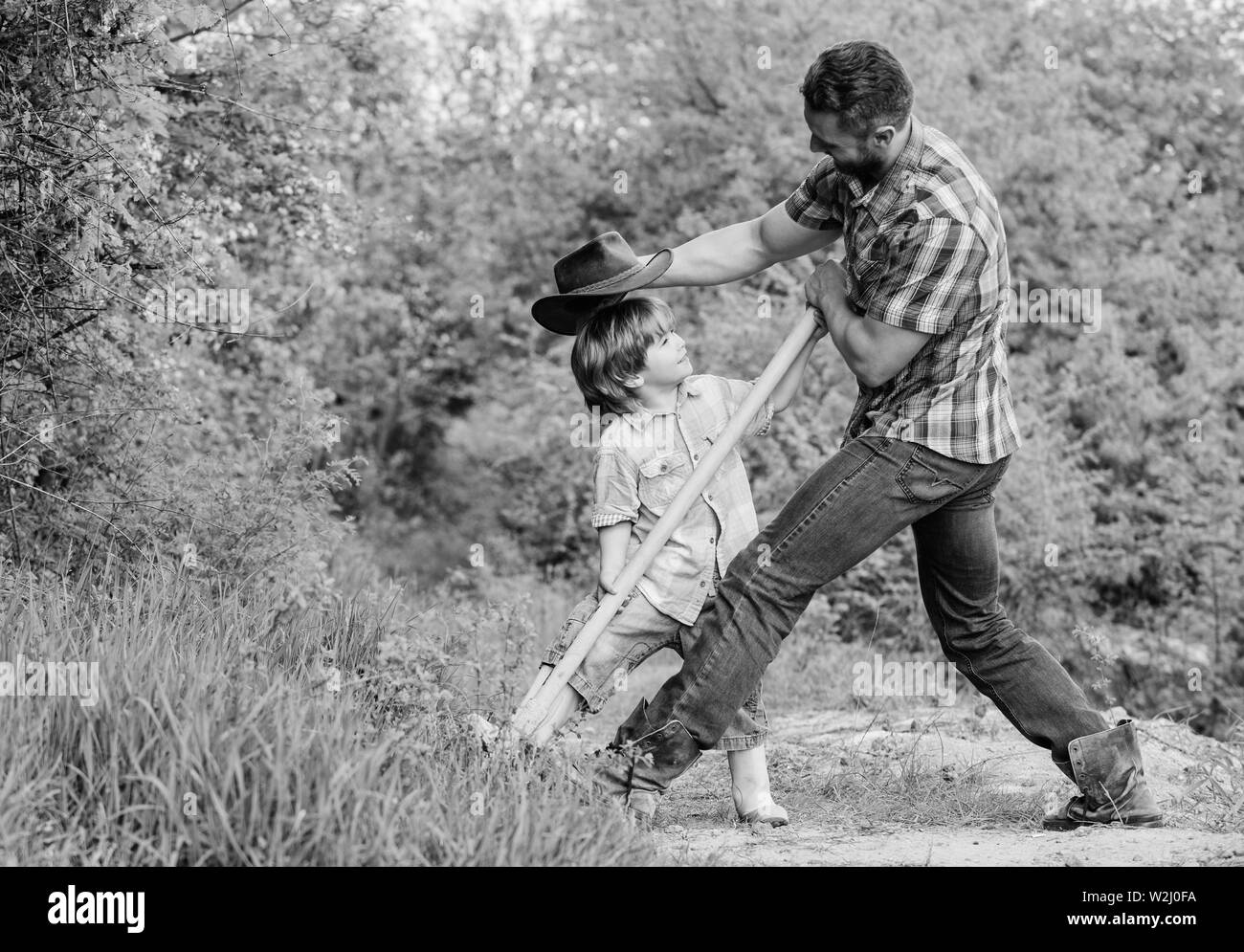 Cute child in nature having fun cowboy dad. Find treasures. Little boy ...